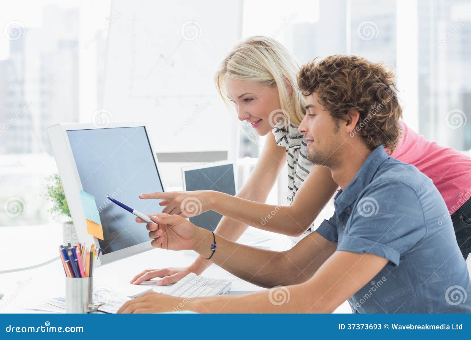 Casual Couple Using Computer in Office Stock Image - Image of caucasian ...