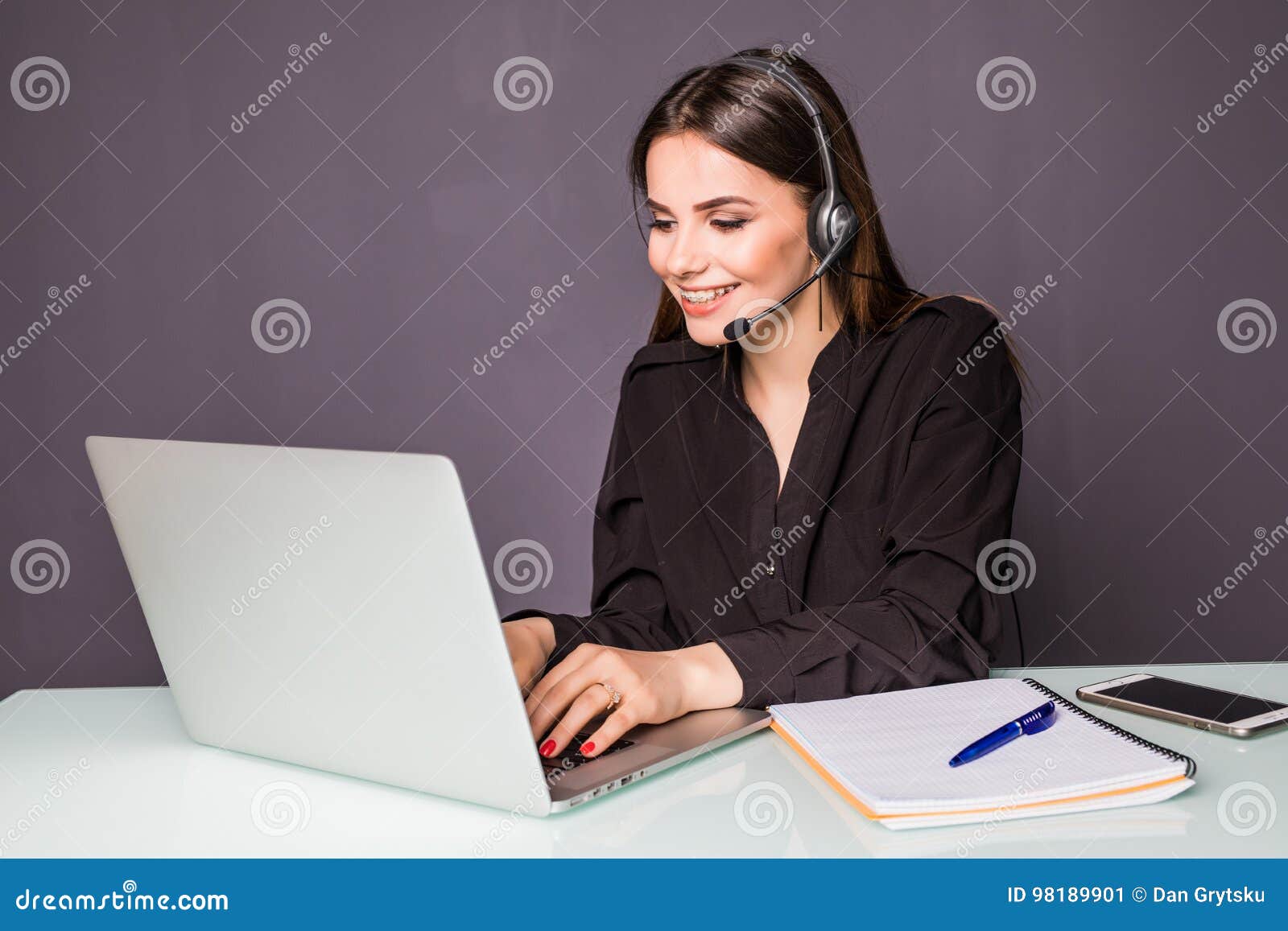 Casual Customer Support Worker in Office with Headset and Laptop in ...