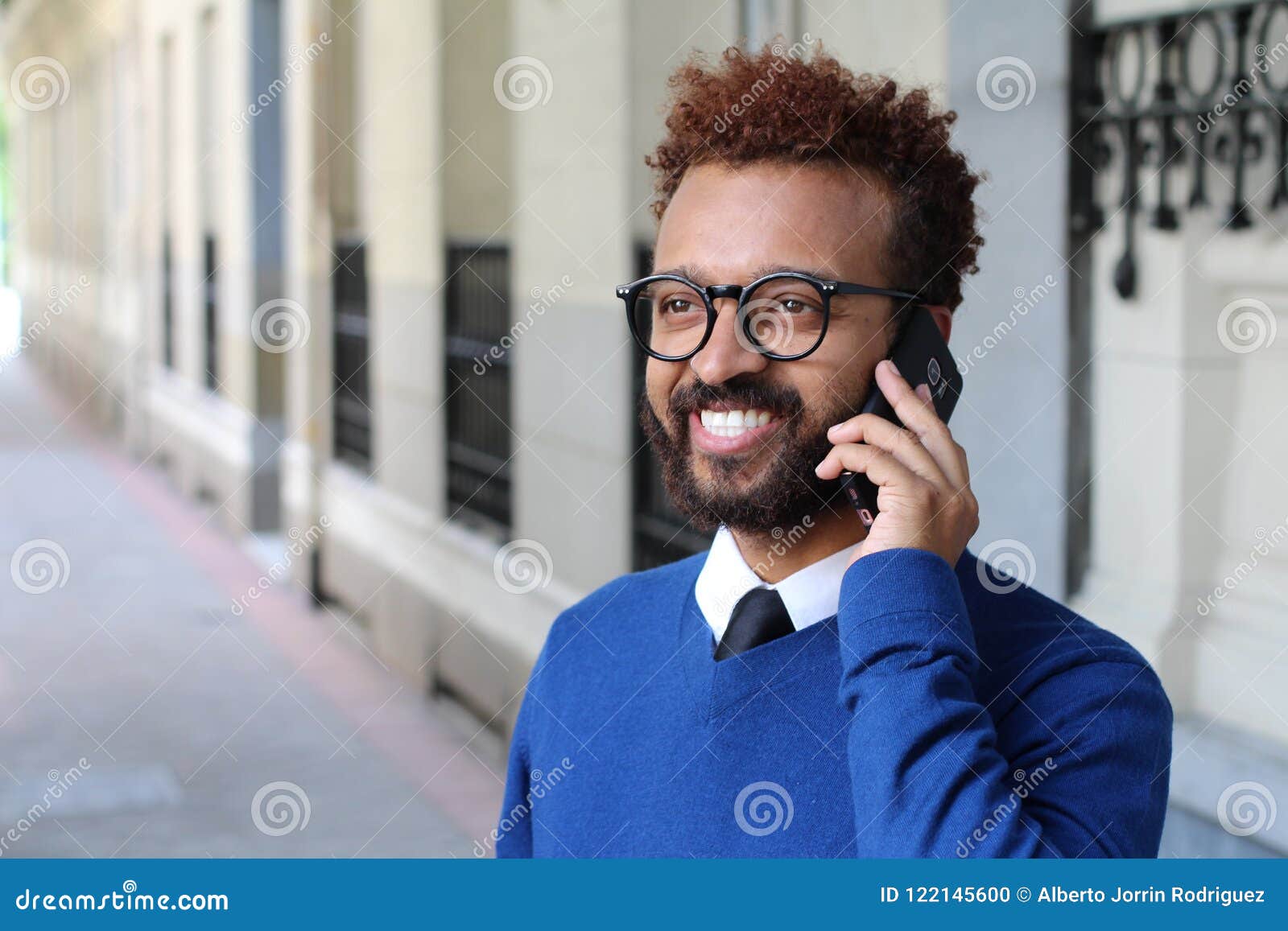 Casual male making a call stock photo. Image of brick - 122145600