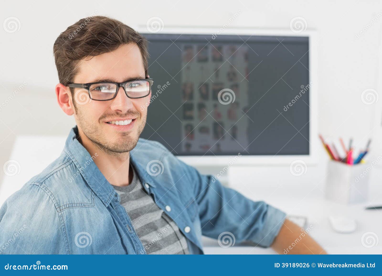Casual Male Photo Editor in Front of Computer Stock Photo - Image of ...