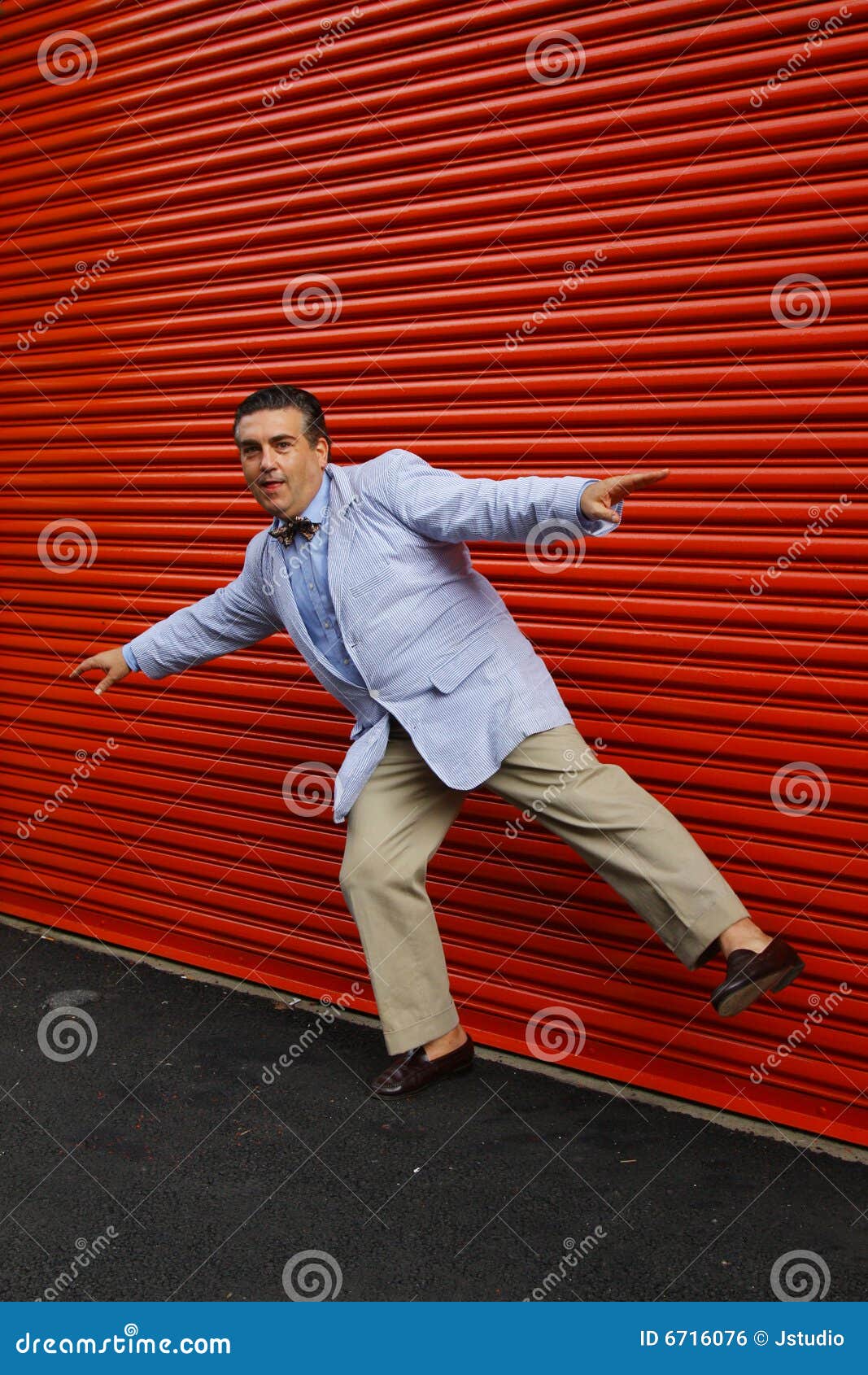 Casual Man Balancing on One Leg Stock Photo - Image of bowtie, standing ...