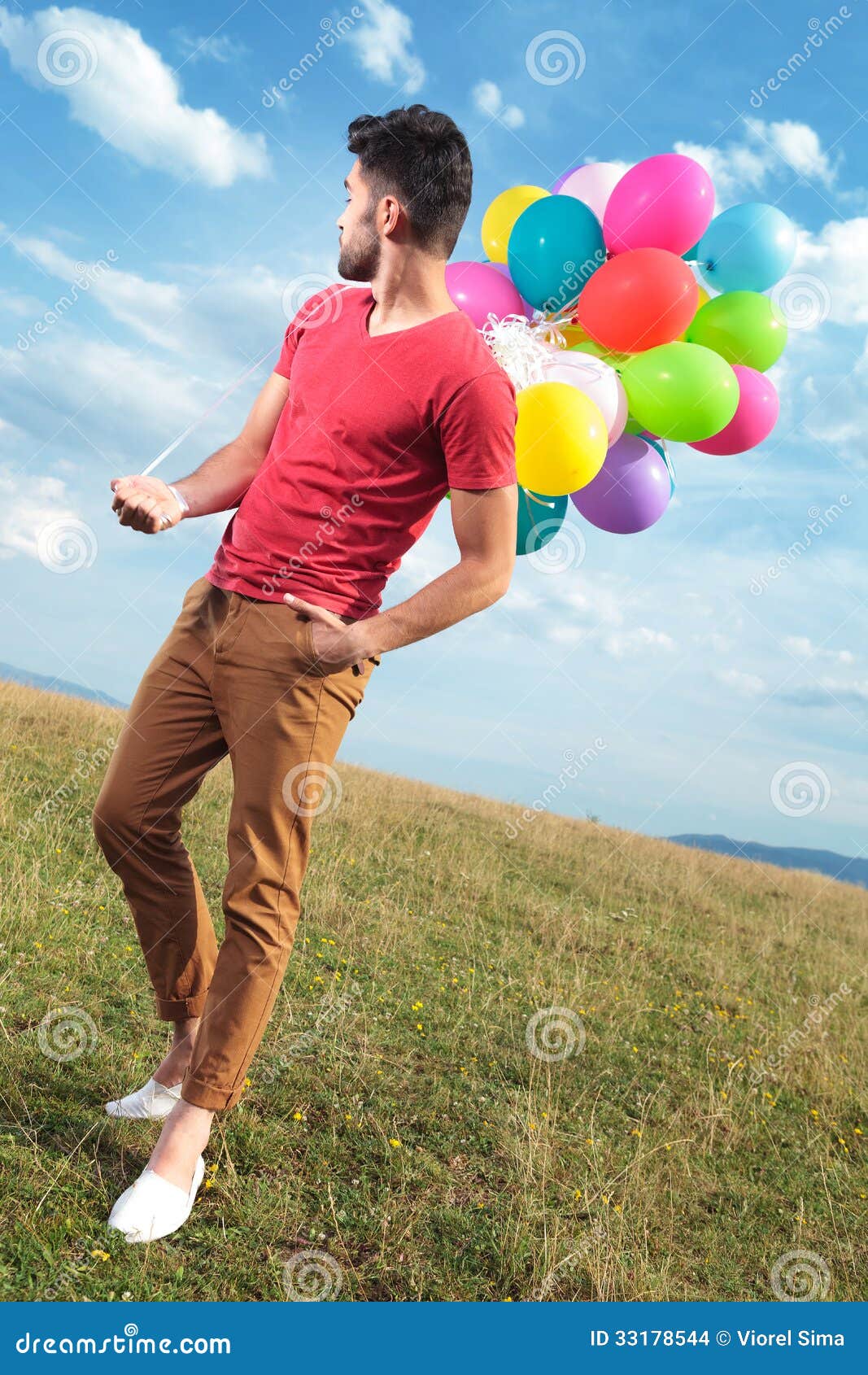 Casual Man with Baloons Looks Back Stock Photo - Image of male ...