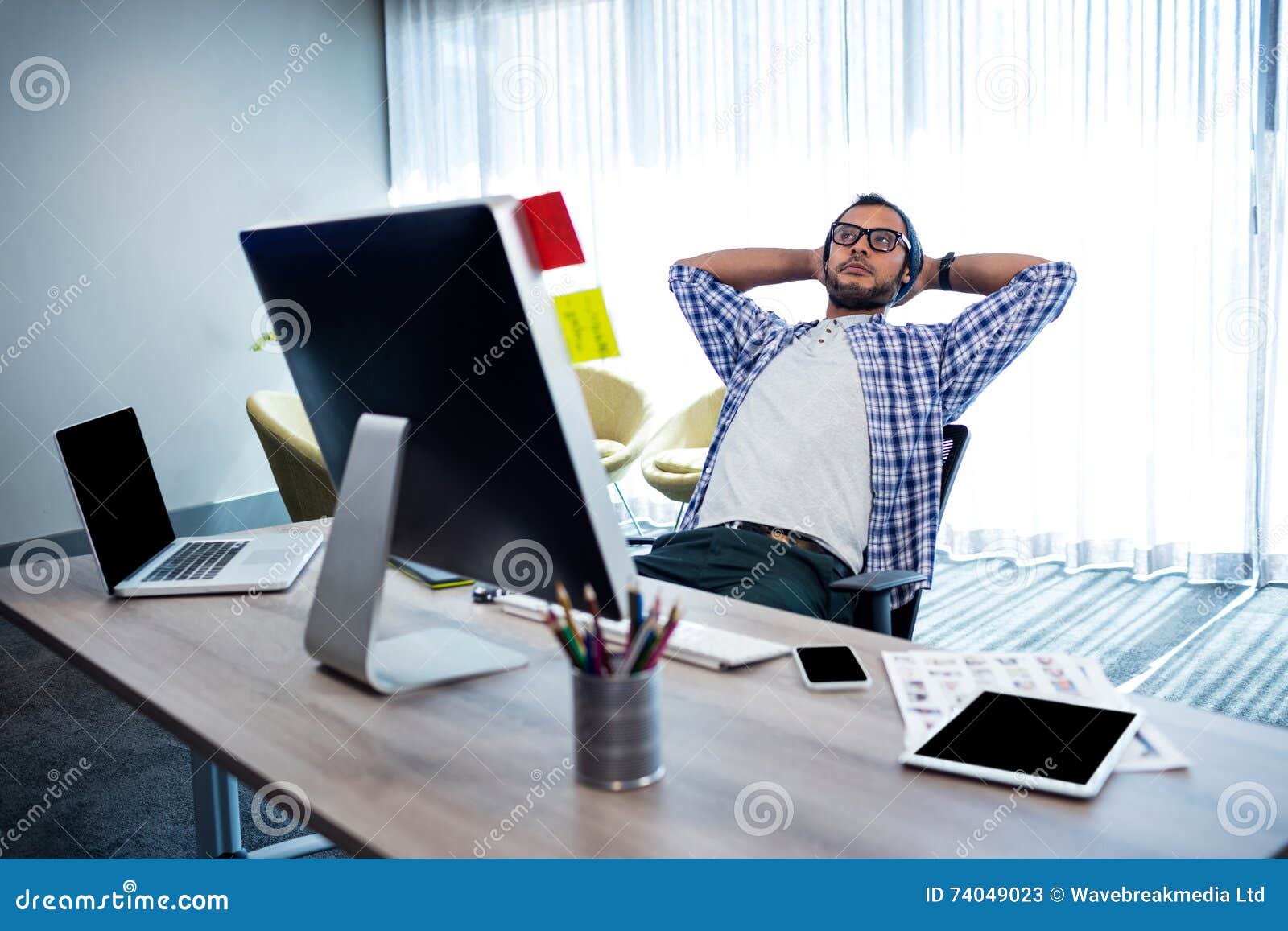 Casual Man with Hands Behind Hand Resting at Desk Stock Image - Image ...