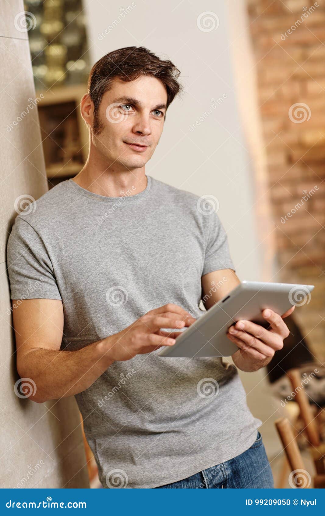 Casual man holding tablet stock photo. Image of single - 99209050