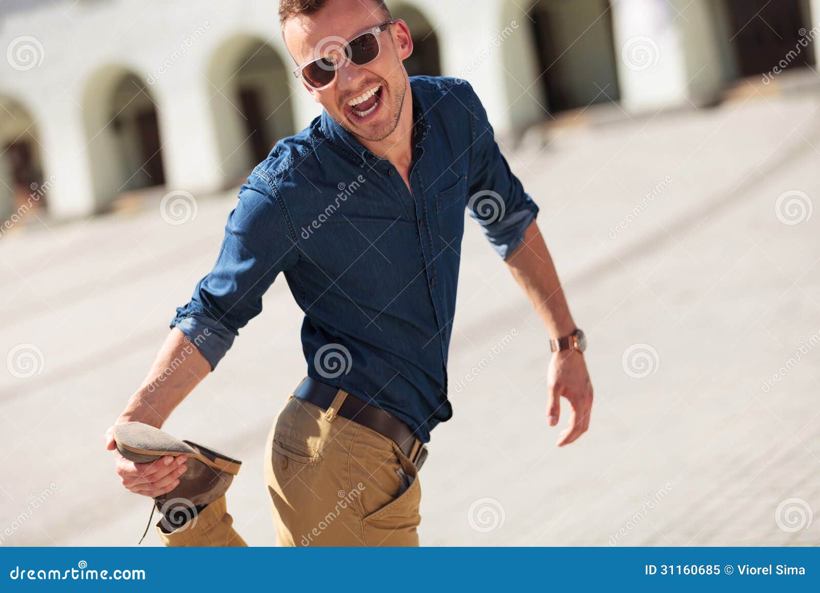 Casual Man Holds His Leg Stock Image Image Of Male Glasses 31160685