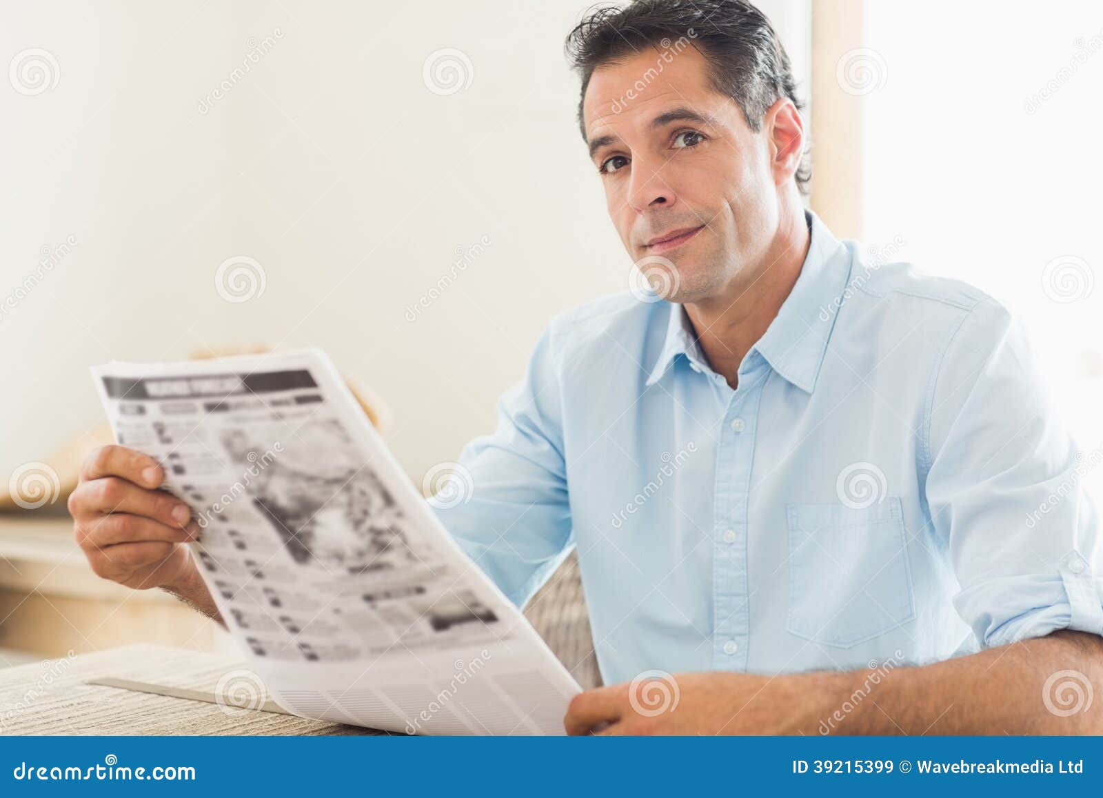 Casual Man with Newspaper Looking Away in Kitchen Stock Image - Image ...