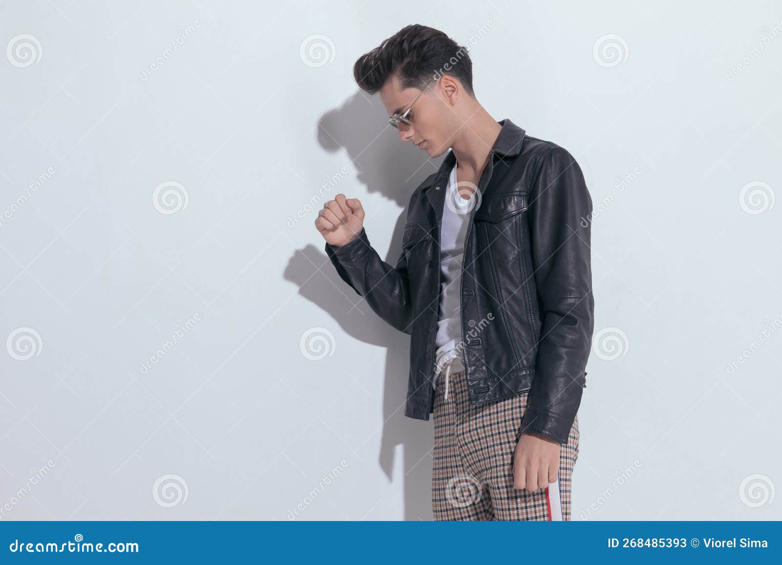 Casual Man Posing while Looking Down with Dramatic Stance Stock Image ...
