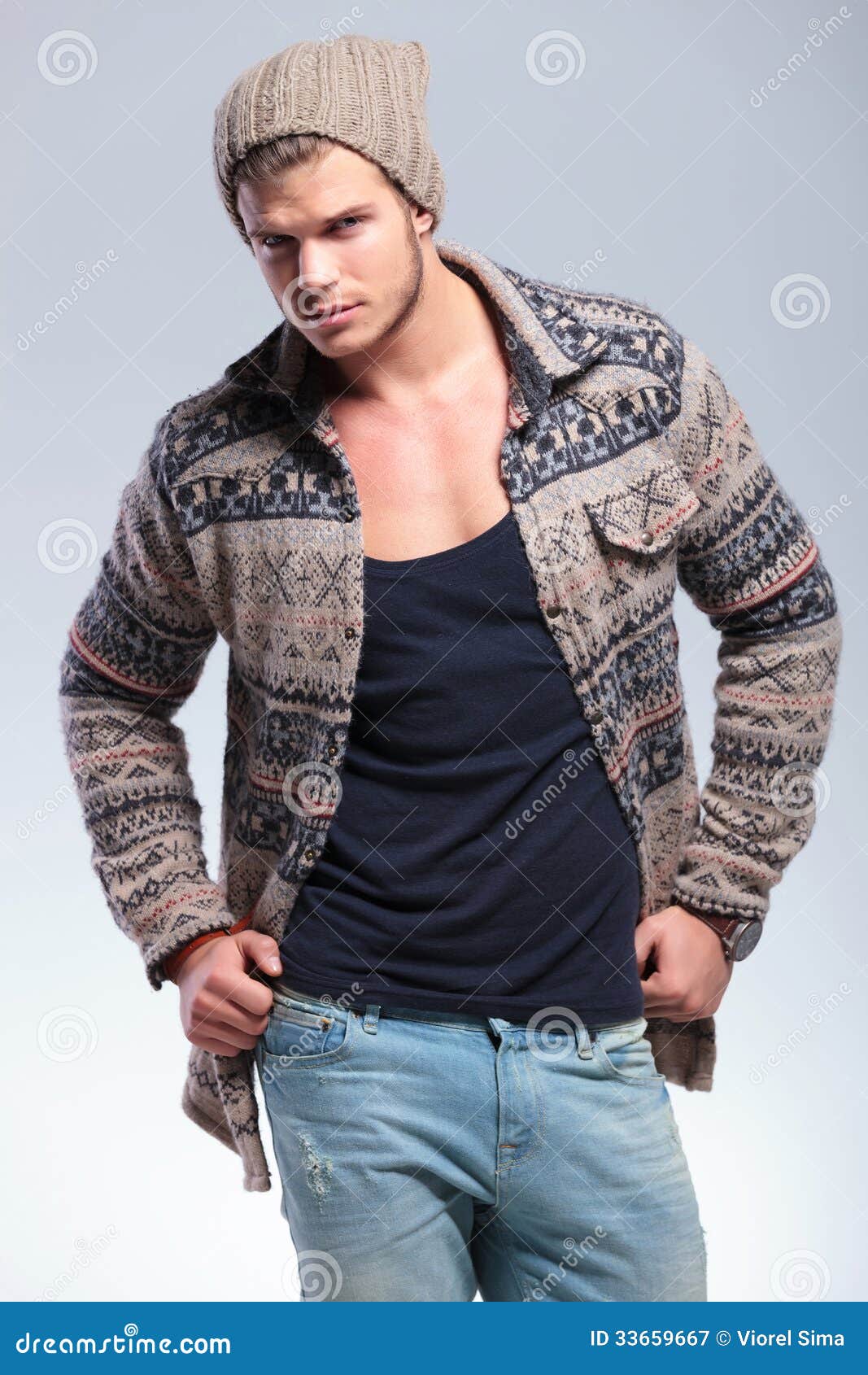Casual Man Pulls Down His T-shirt Stock Image - Image of blue, dramatic ...