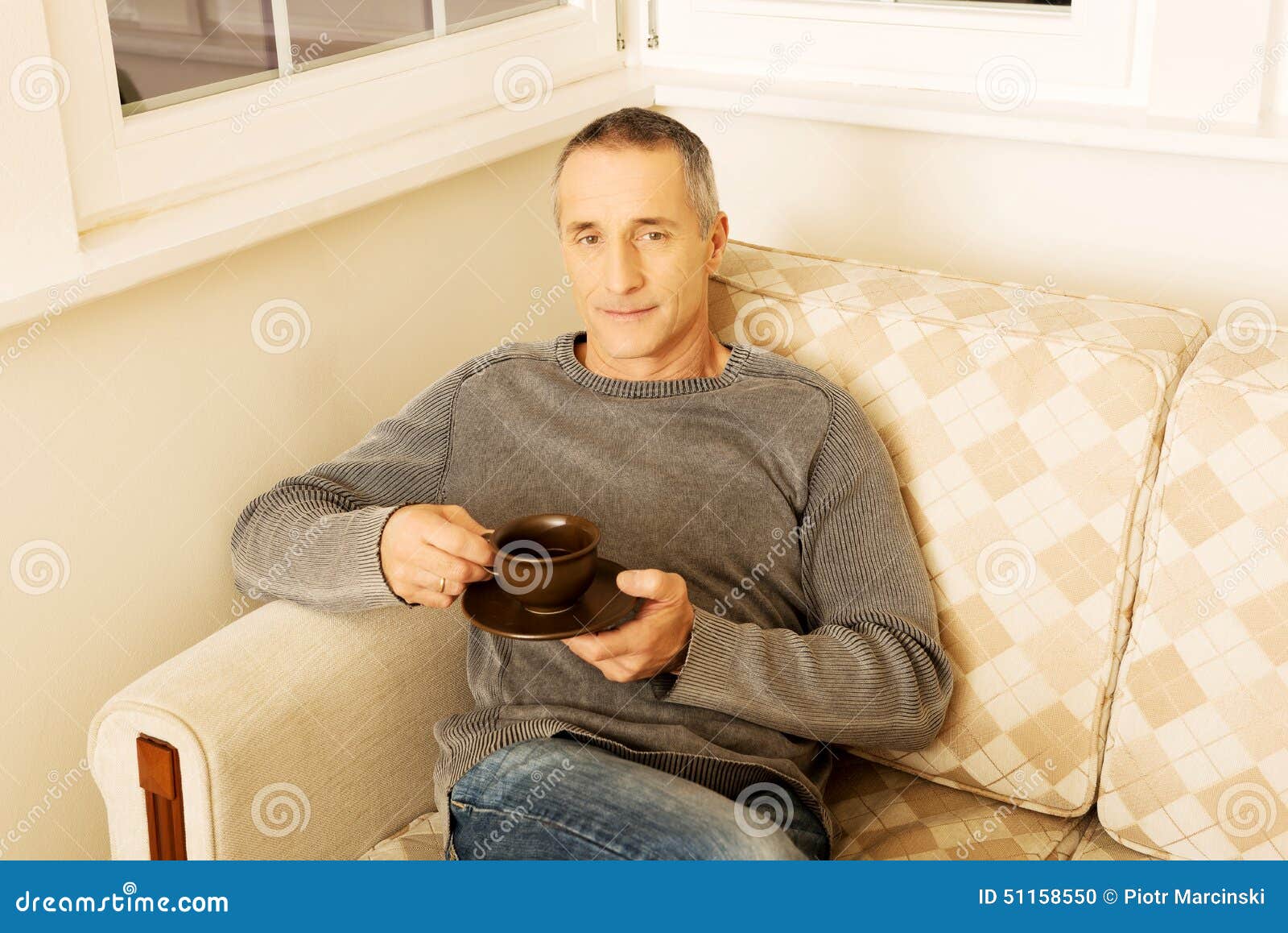 Casual Man Sitting on Couch Drinking Coffee Stock Photo - Image of ...