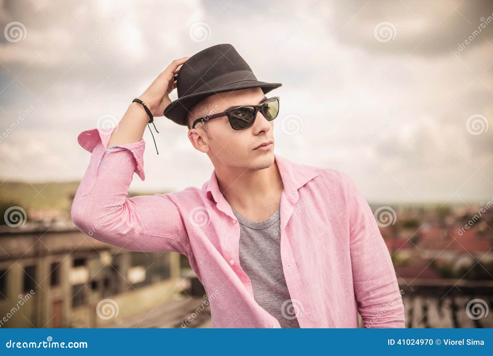 Casual Man with Sunglasses Fixing His Hat on Head Stock Photo - Image ...