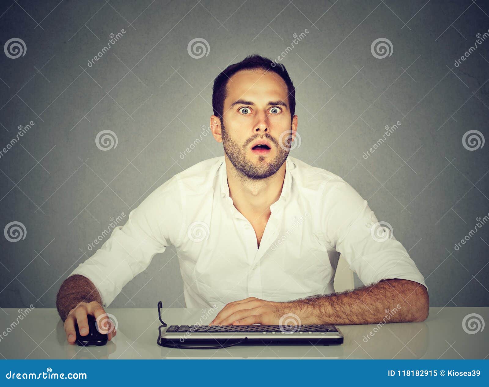 Amazed Man Using Computer at Desk Stock Image - Image of person, desk ...