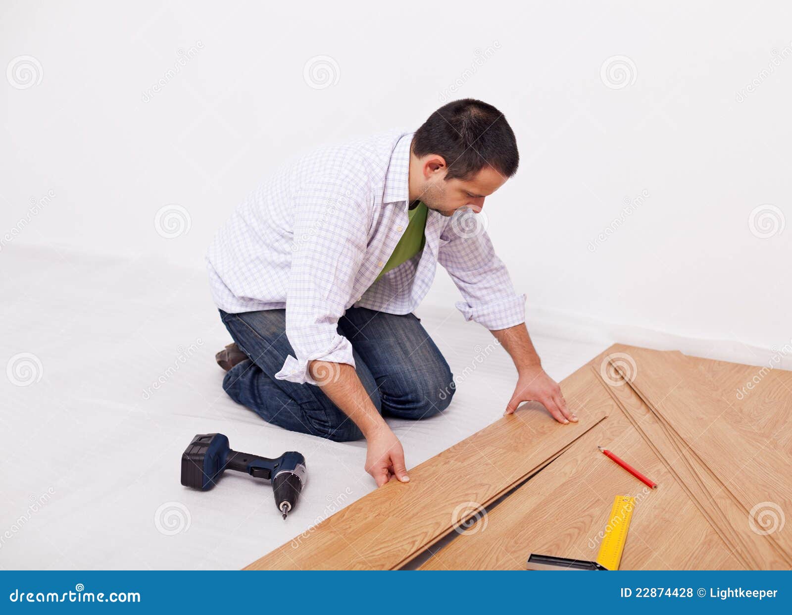 Casual Man or Worker Installing Flooring Stock Photo - Image of male ...