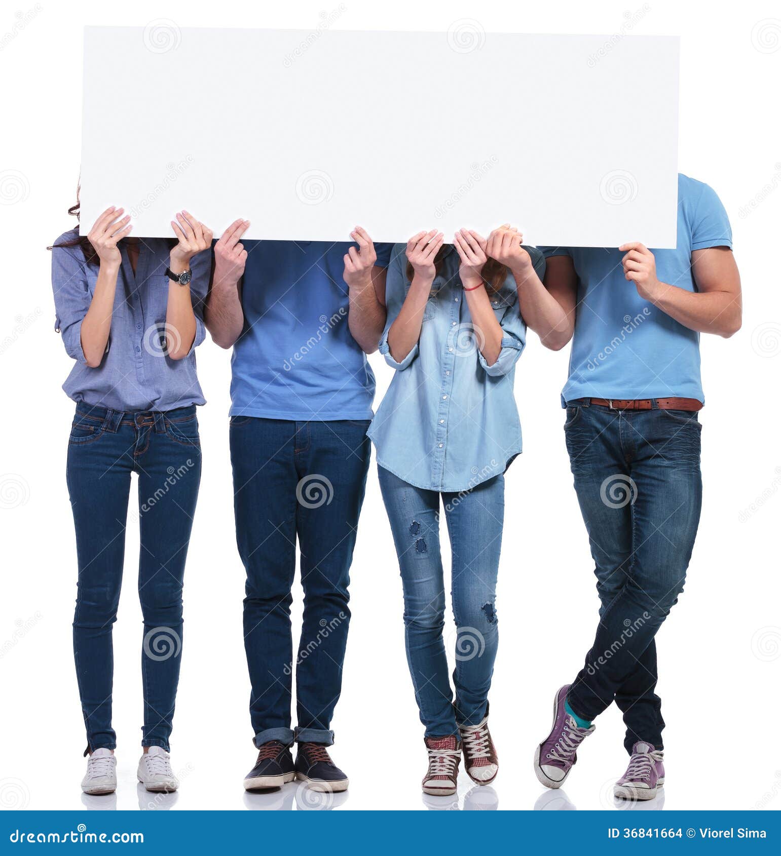 Casual People Hiding Their Faces Behind a Blank Banner Stock Photo ...