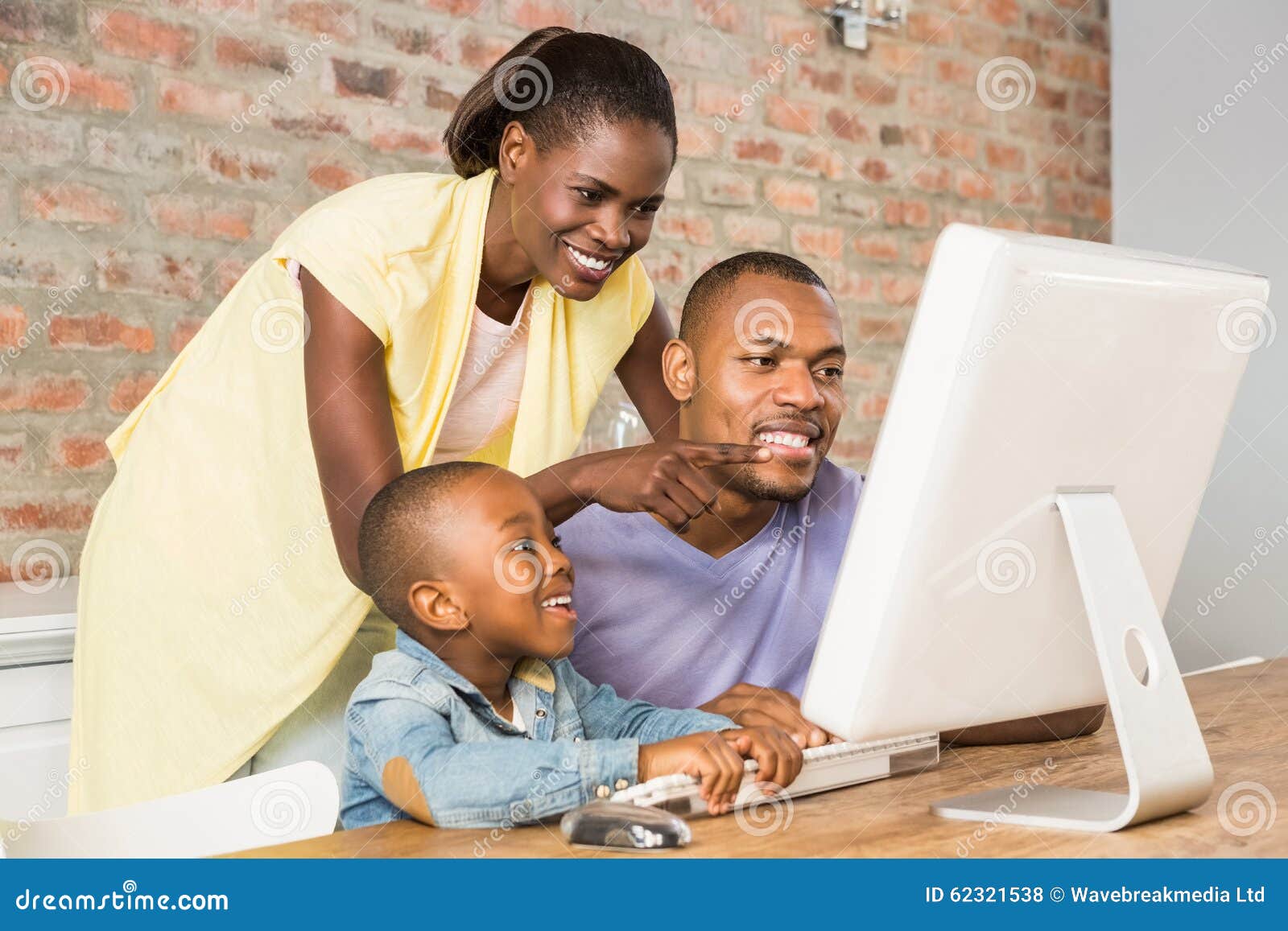 Casual Smiling Family on a Computer Stock Photo - Image of household ...
