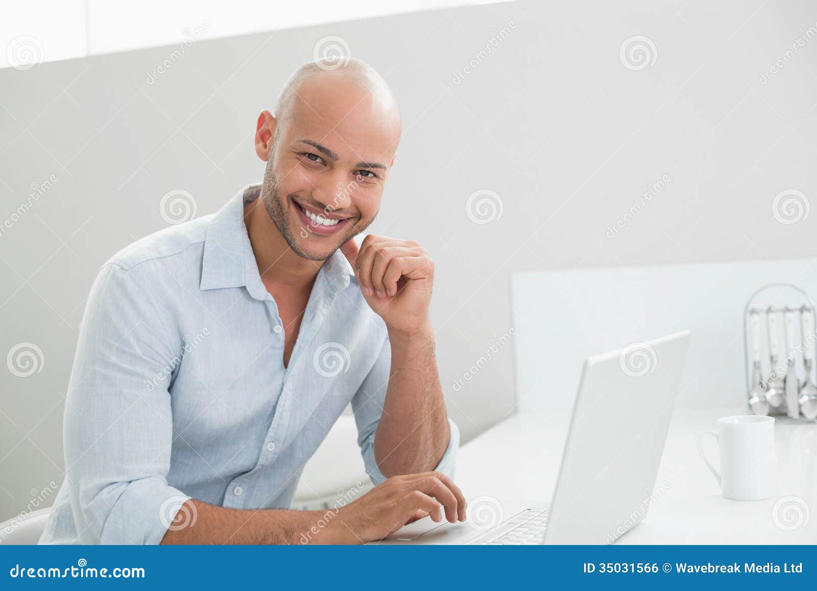 Casual Smiling Man Using Laptop at Home Stock Photo - Image of 2529 ...