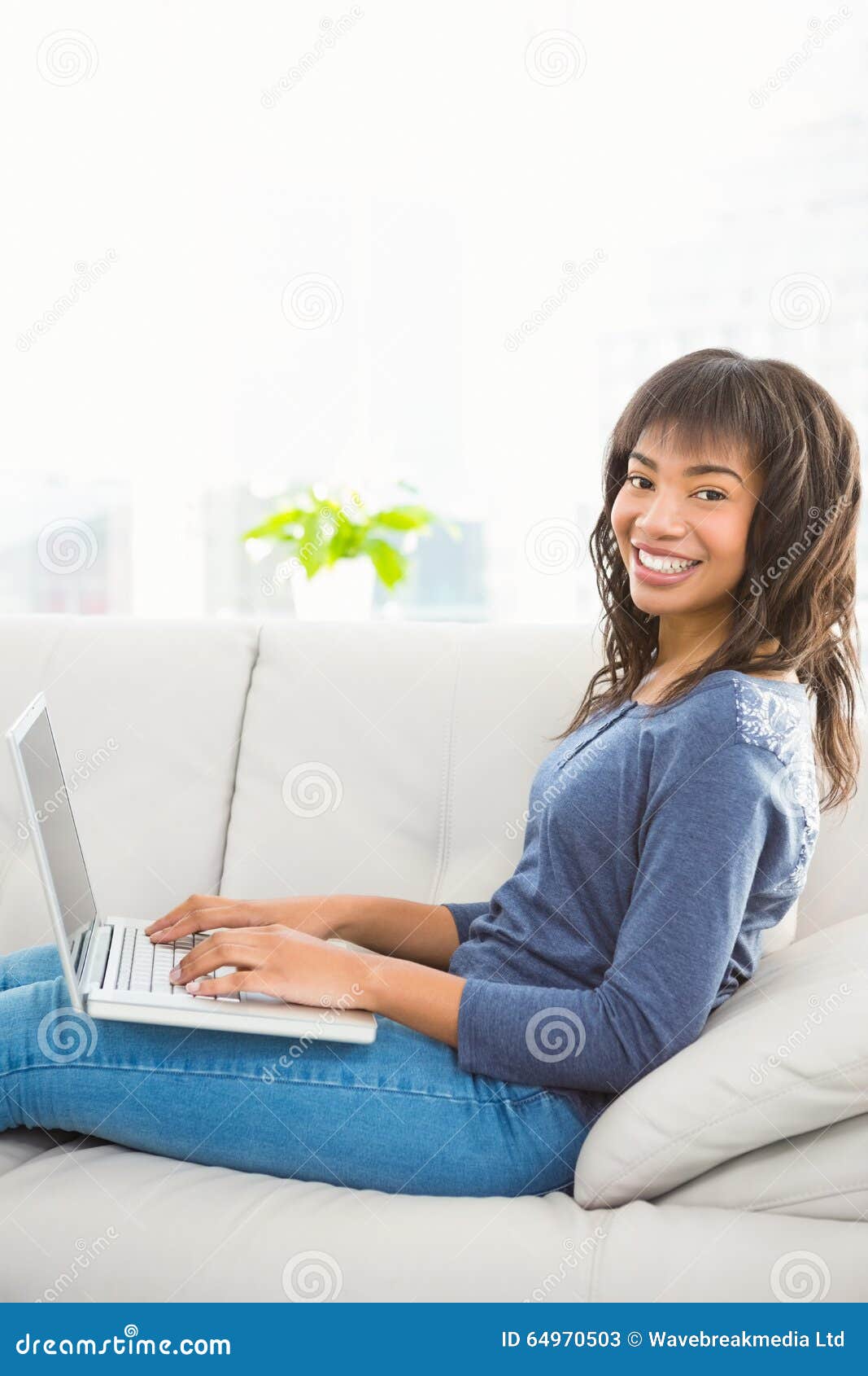 Casual Smiling Woman Using Laptop on the Couch Stock Image - Image of ...