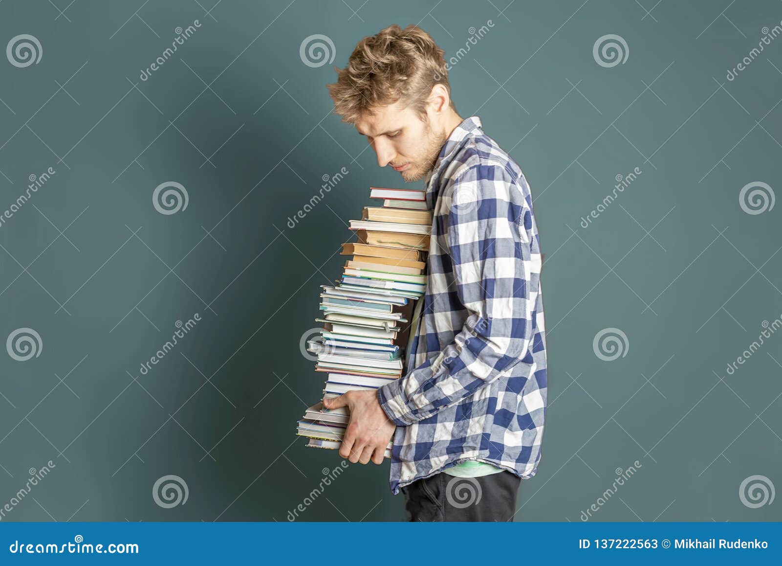 Casual Student Carry Huge Stack of Books on Dark Background F Stock ...