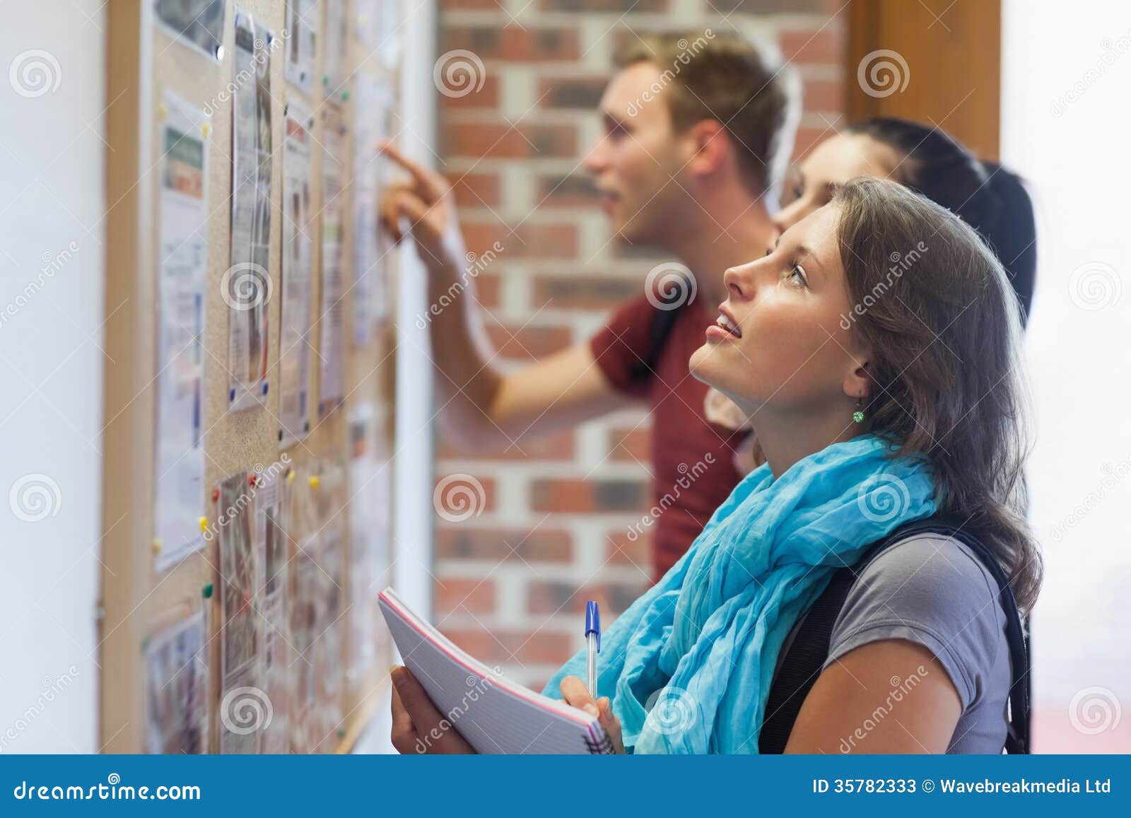 Casual Students Looking at Notice Board Stock Image - Image of shoulder ...