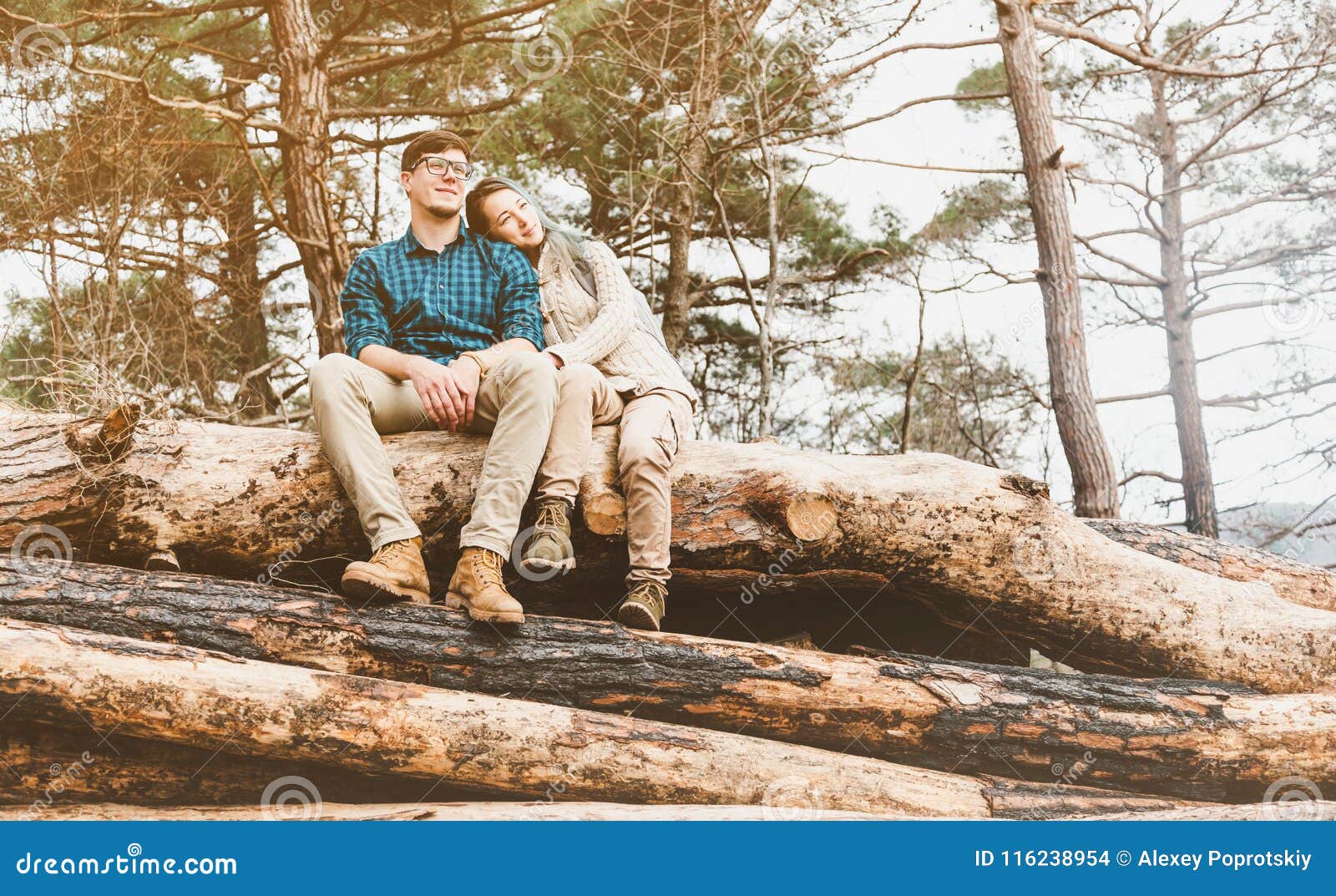 Couple Resting on Tree Trunks. Stock Photo - Image of relationship ...