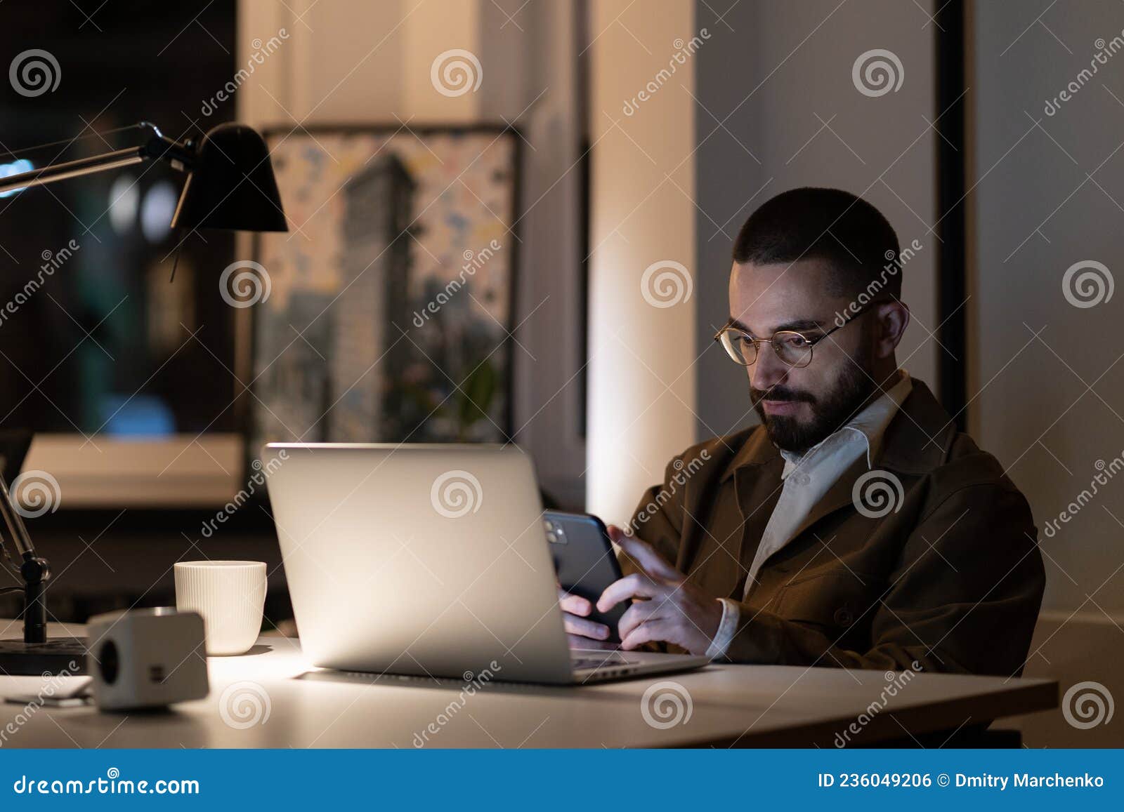 Casual Web Designer or Programmer Guy Working Alone in Office Late at ...