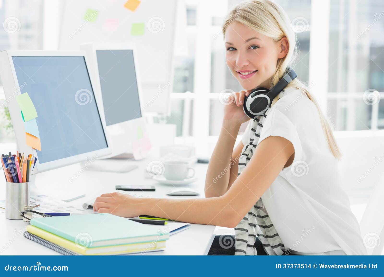 Casual Woman with Headset Using Computer in Office Stock Photo - Image ...