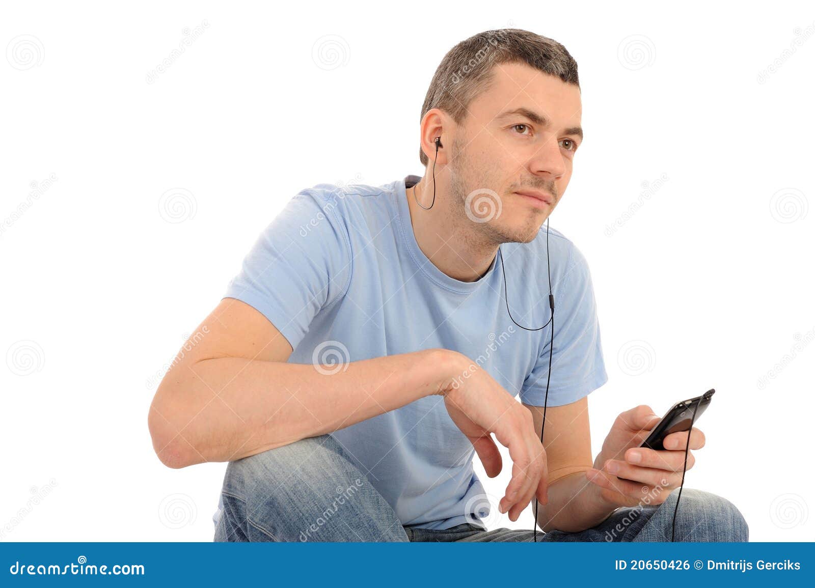 Casual Young Man with Cell Phone and Headphones Stock Photo - Image of ...