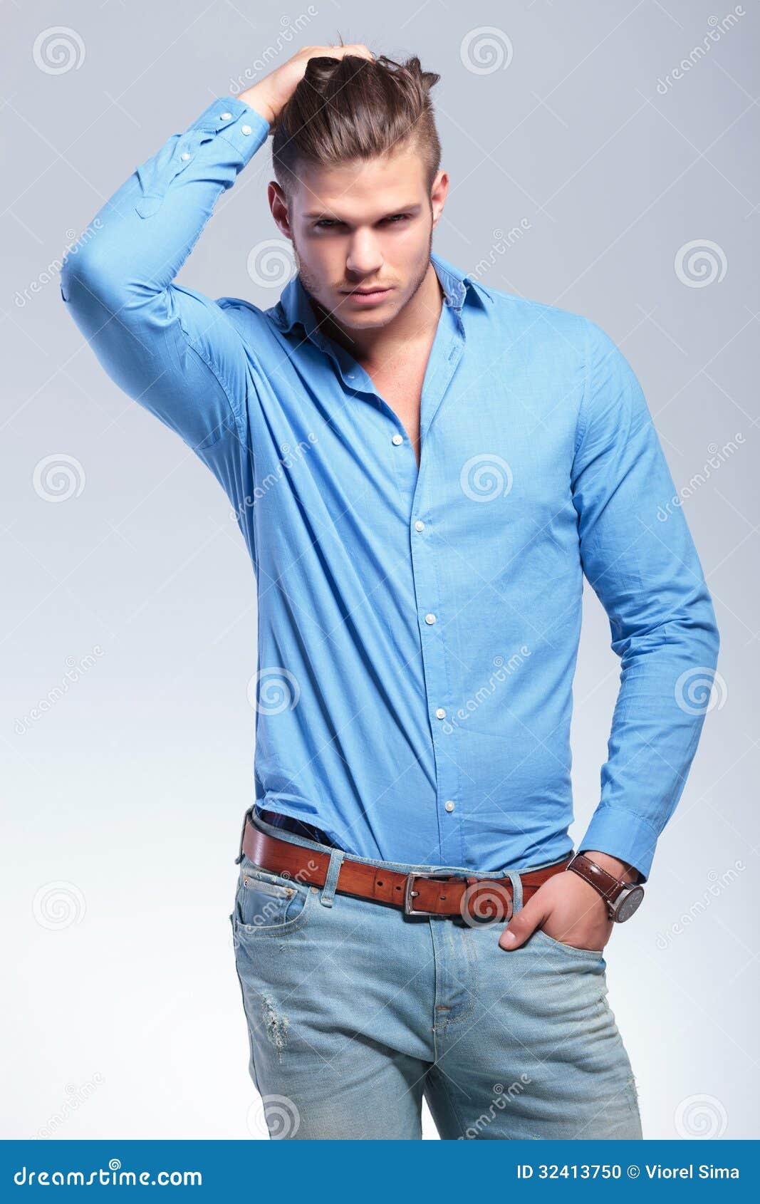 Casual Young Man Pulls Back His Hair Stock Photo - Image of fashion ...