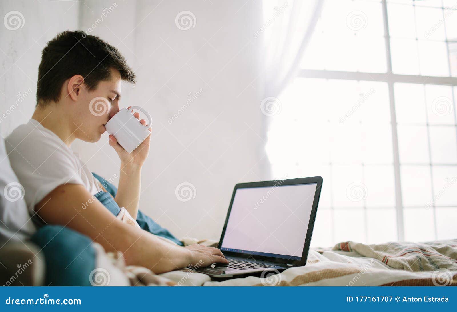 Casual Young Man Using Laptop in Bed at Home Stock Image - Image of ...
