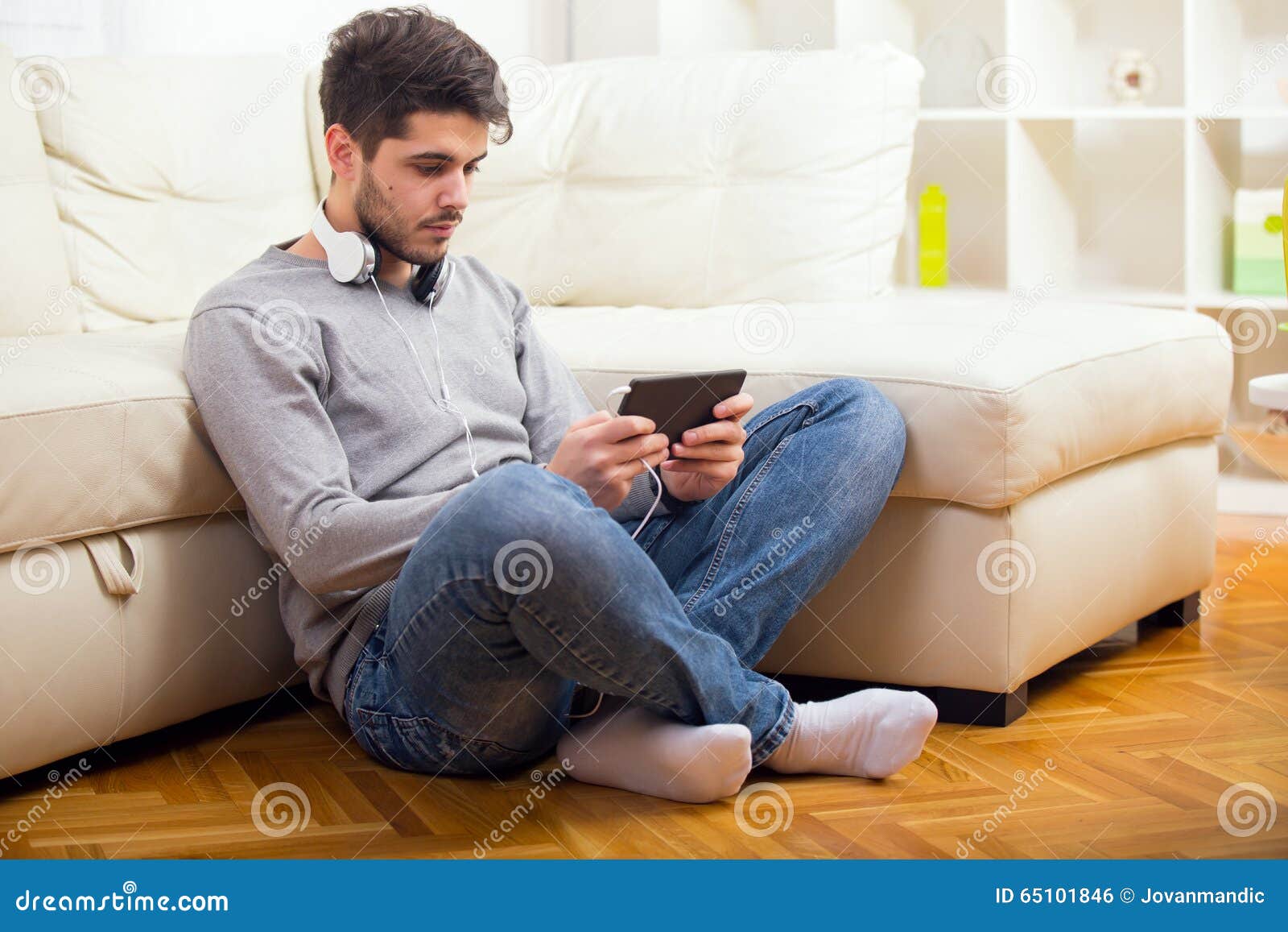 Casual Young Man Using a Tablet at Home Stock Photo - Image of handsome ...