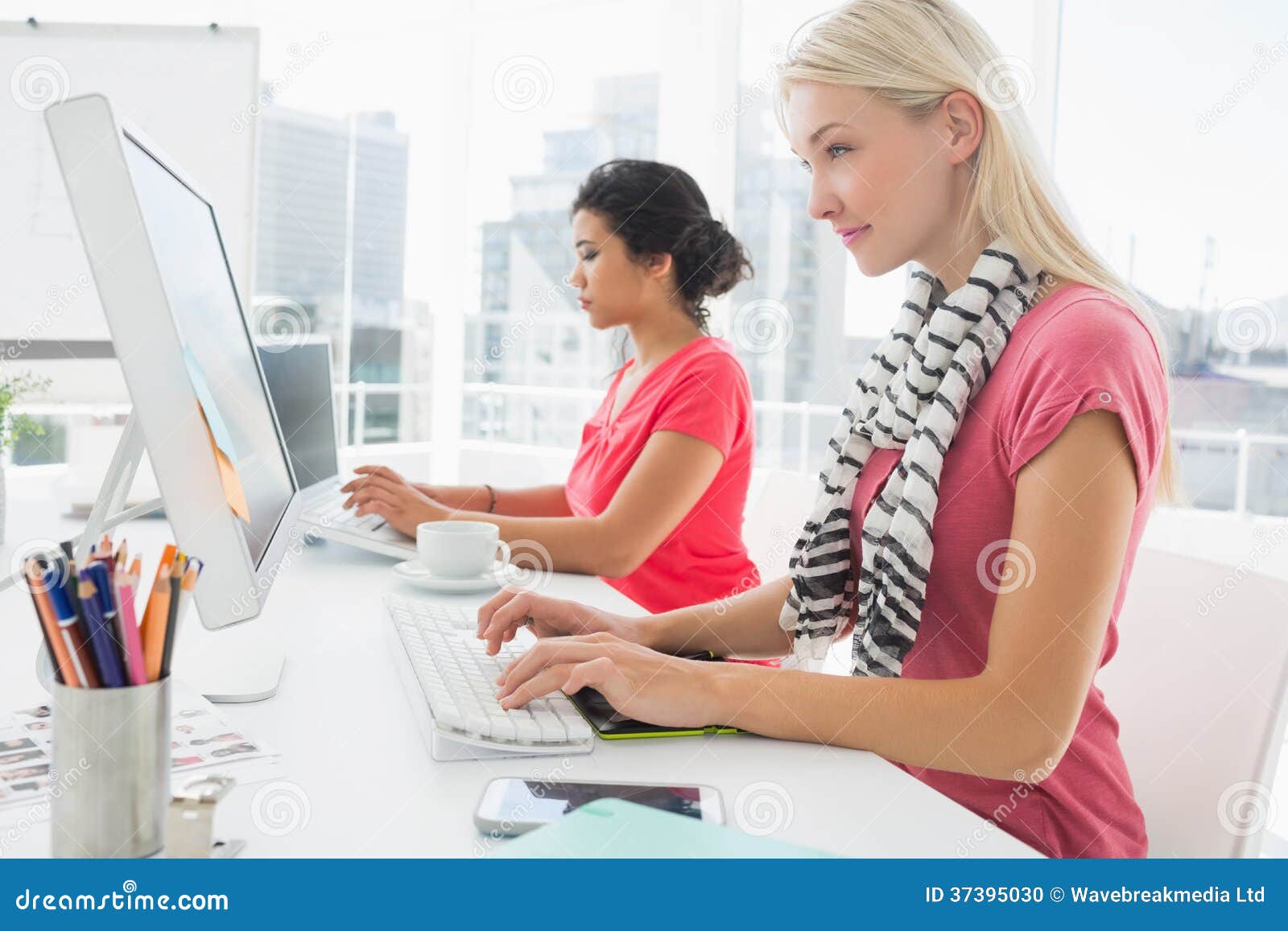 Casual Young Women Using Computers in Office Stock Photo - Image of ...