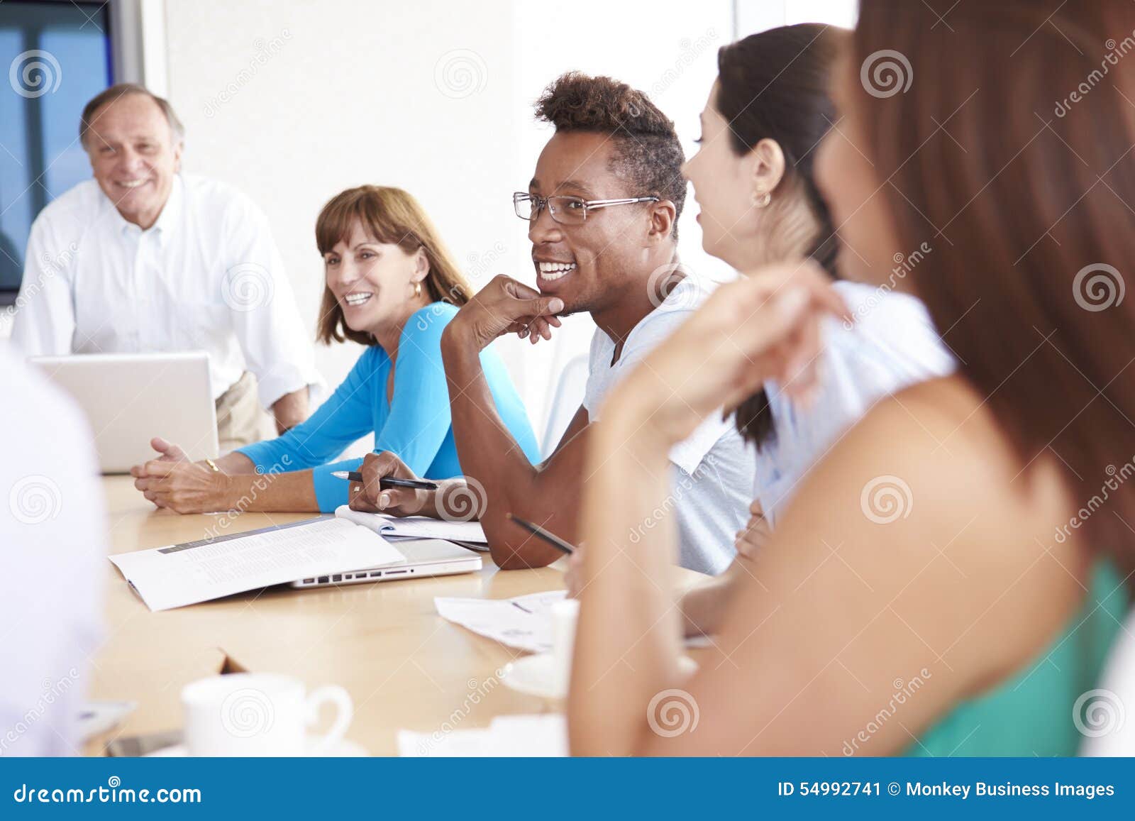 Casually Dressed Businesspeople Having Meeting in Boardroom Stock Image ...