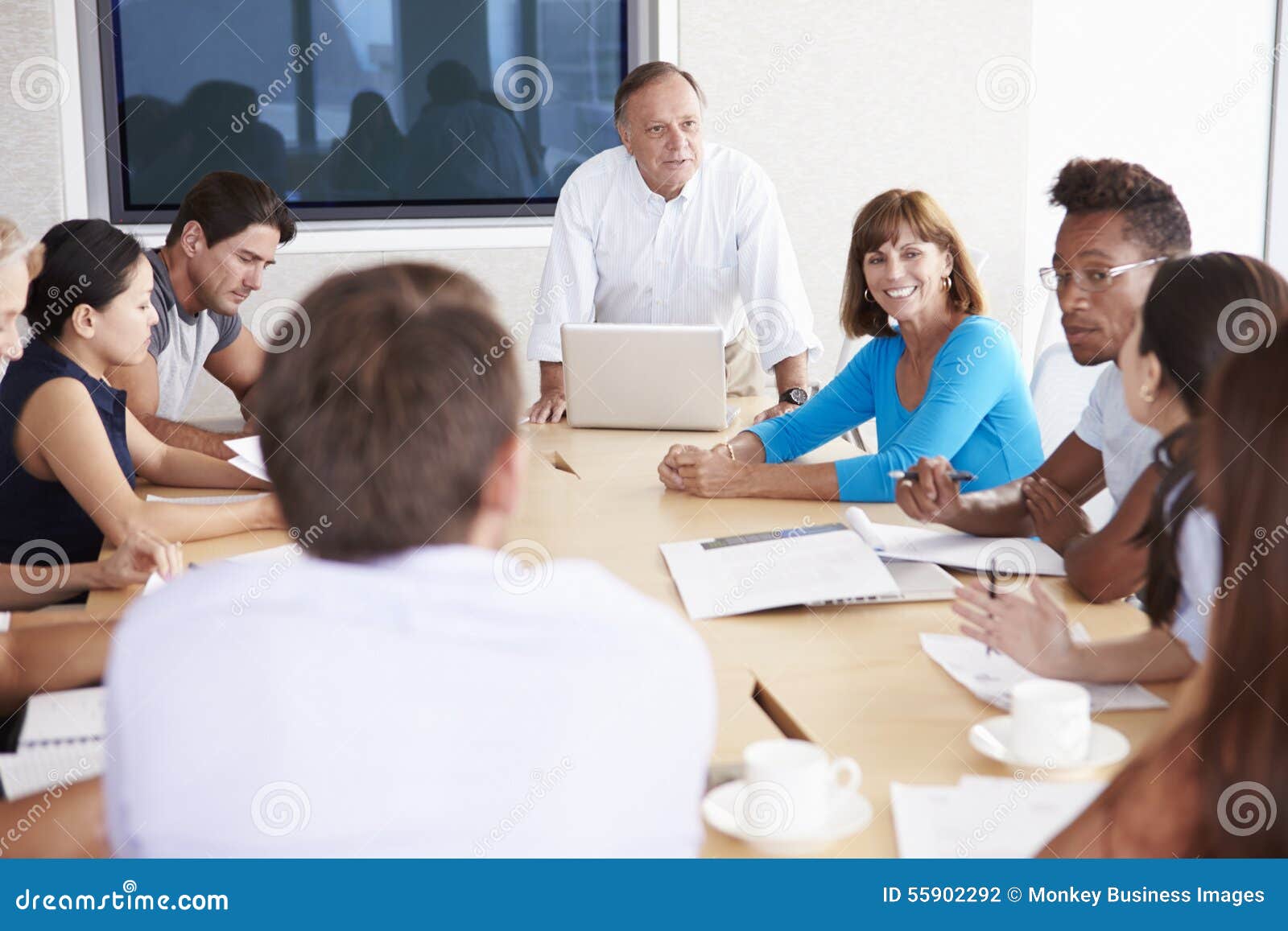 Casually Dressed Businesspeople Having Meeting in Boardroom Stock Photo ...