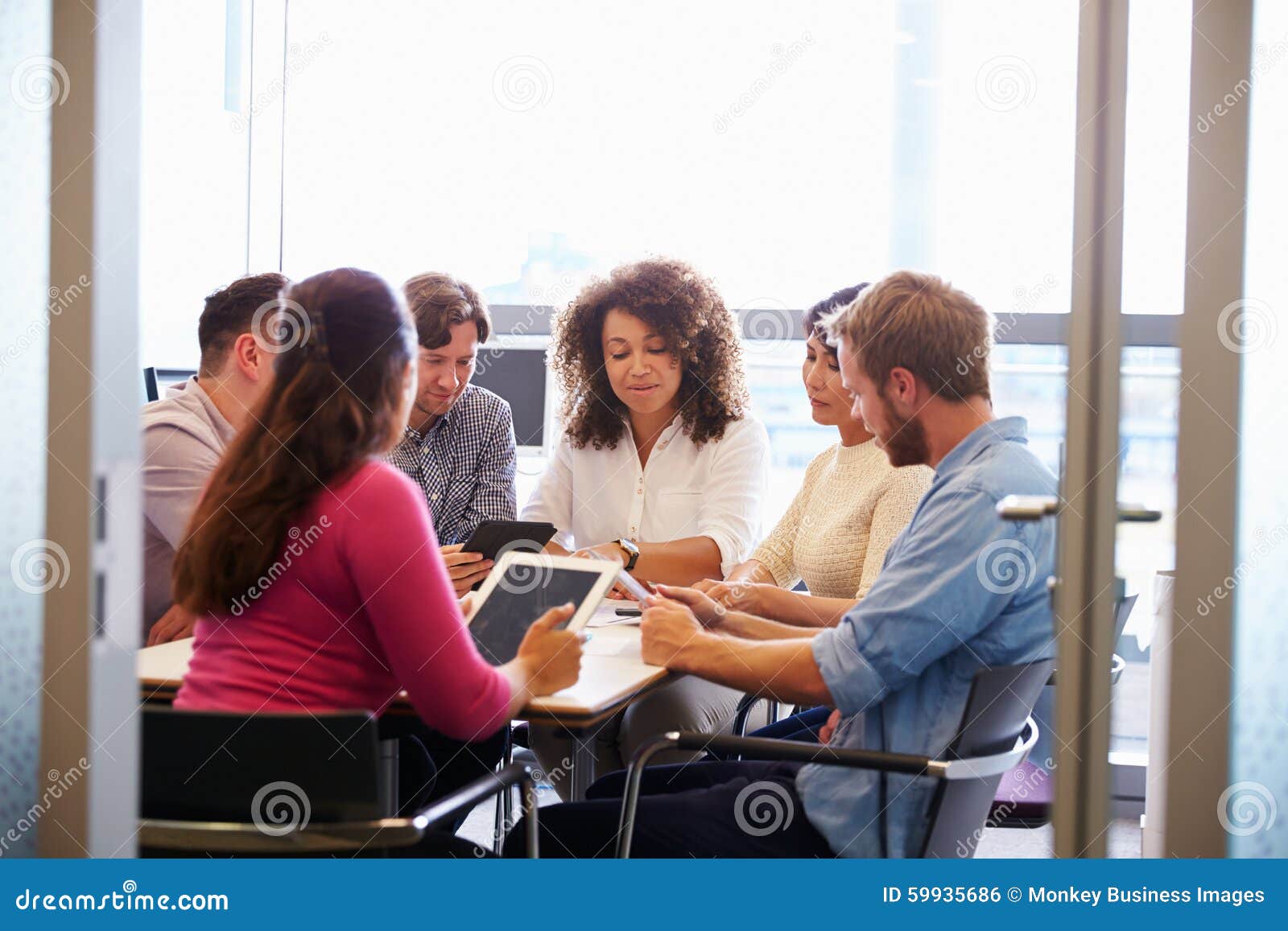 Casually Dressed Colleagues Talking in a Meeting Room Stock Photo ...