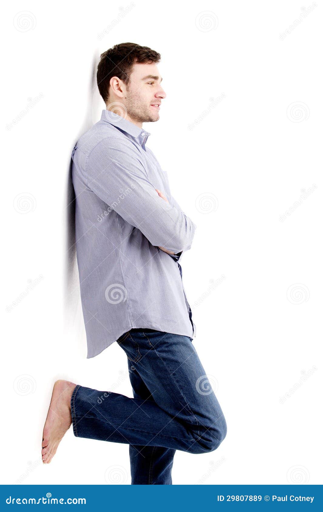 Handsome Man Leaning Against a White Wall Stock Image - Image of happy ...