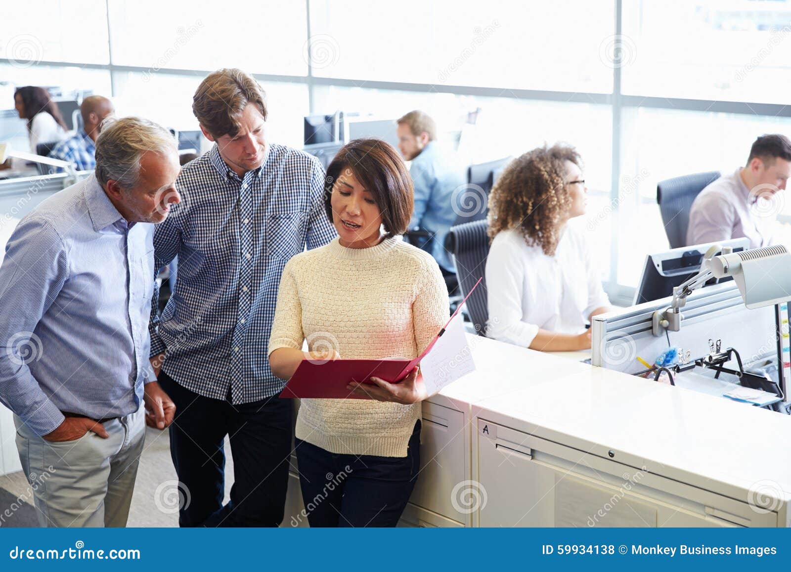 Casually Dressed Staff Standing in a Busy Open Plan Office Stock Photo ...