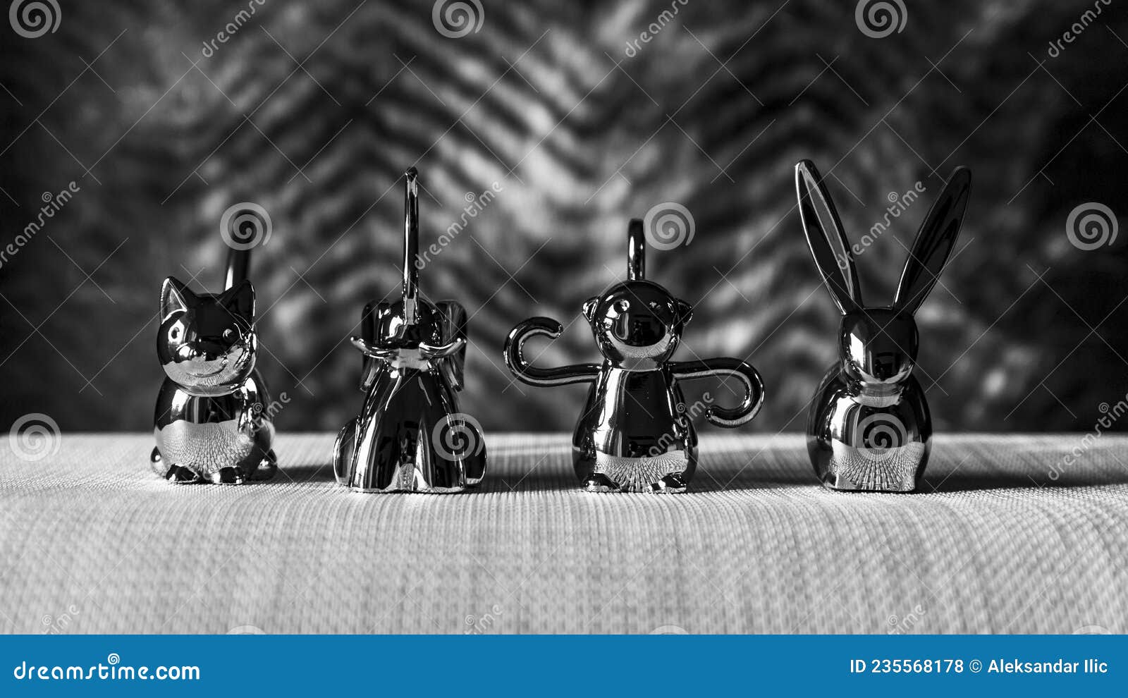 Cat, Elephant, Monkey and Rabbit Metal Shiny Figurine Stock Photo ...