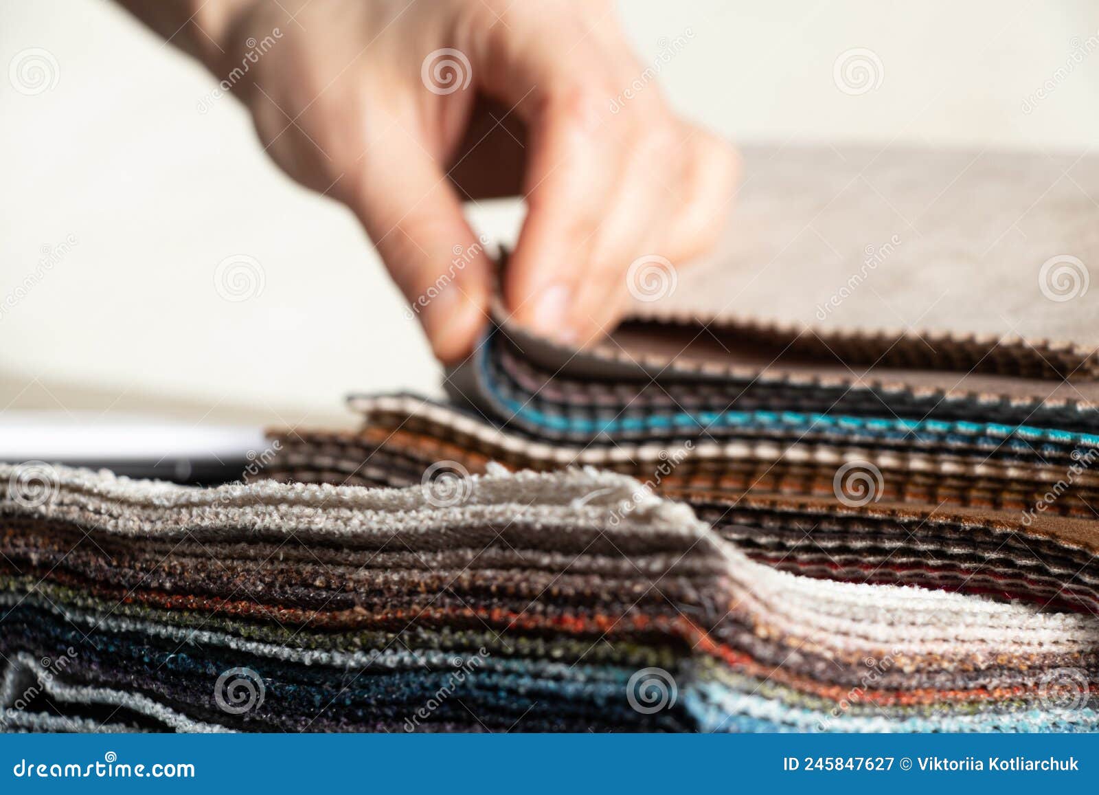 A Catalog of Different Colors of Fabrics in the Hands of a Girl for the ...
