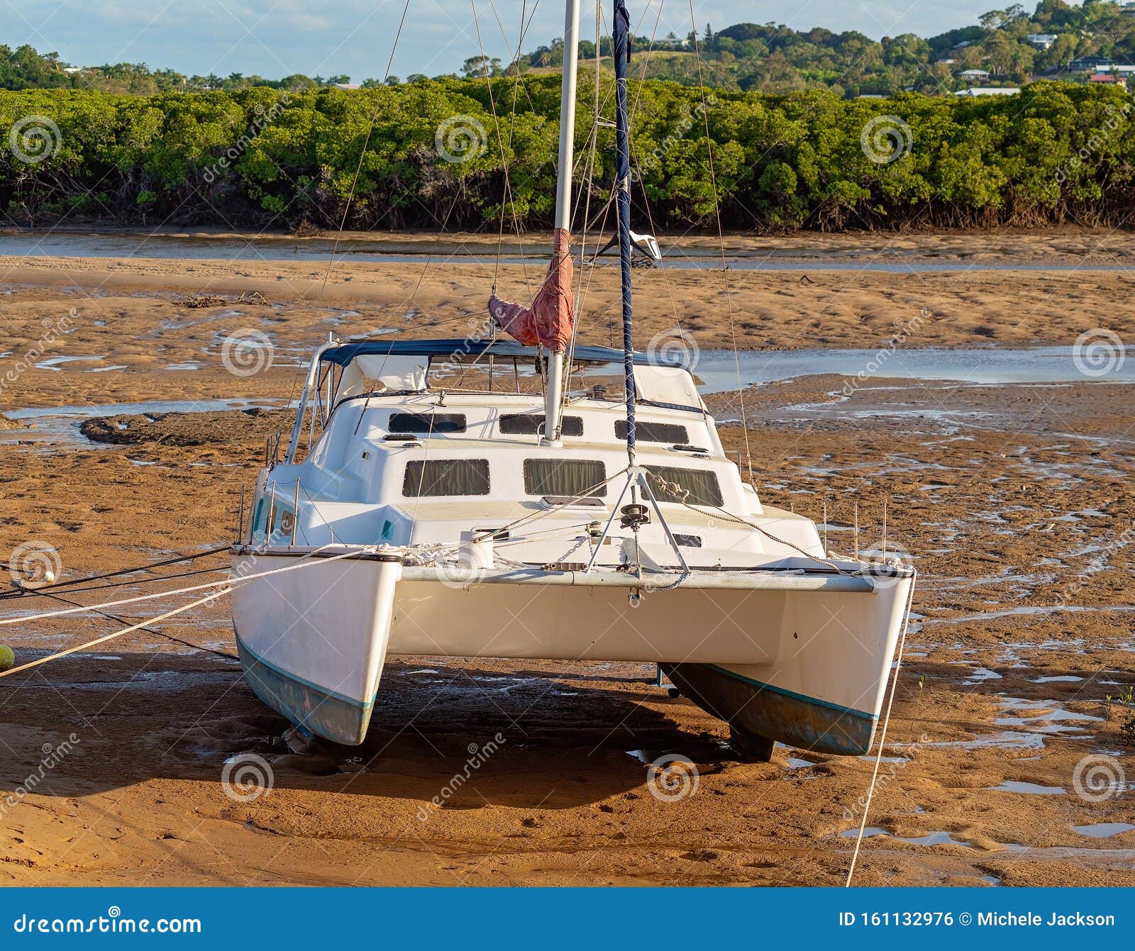 Catamaran Beached in the Mud at Low Tide Stock Photo - Image of creek ...