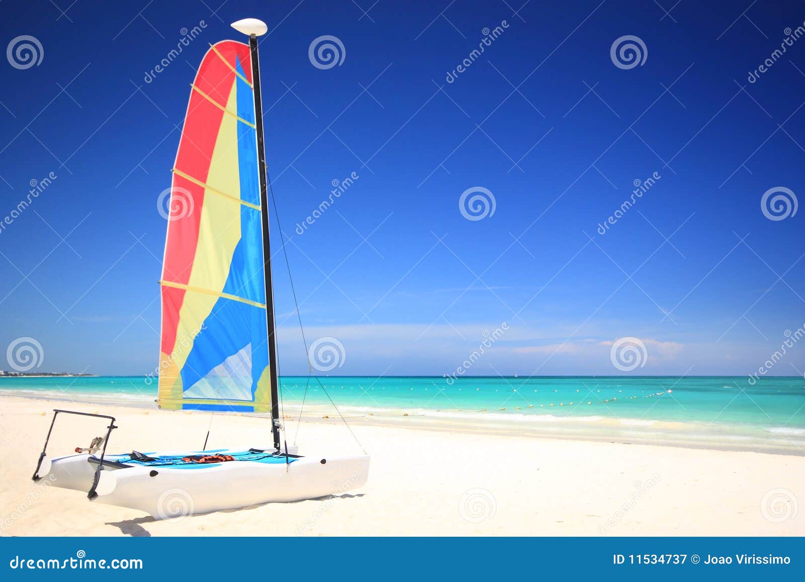 Catamaran Sailboat on the Beach Stock Image - Image of sail, color ...
