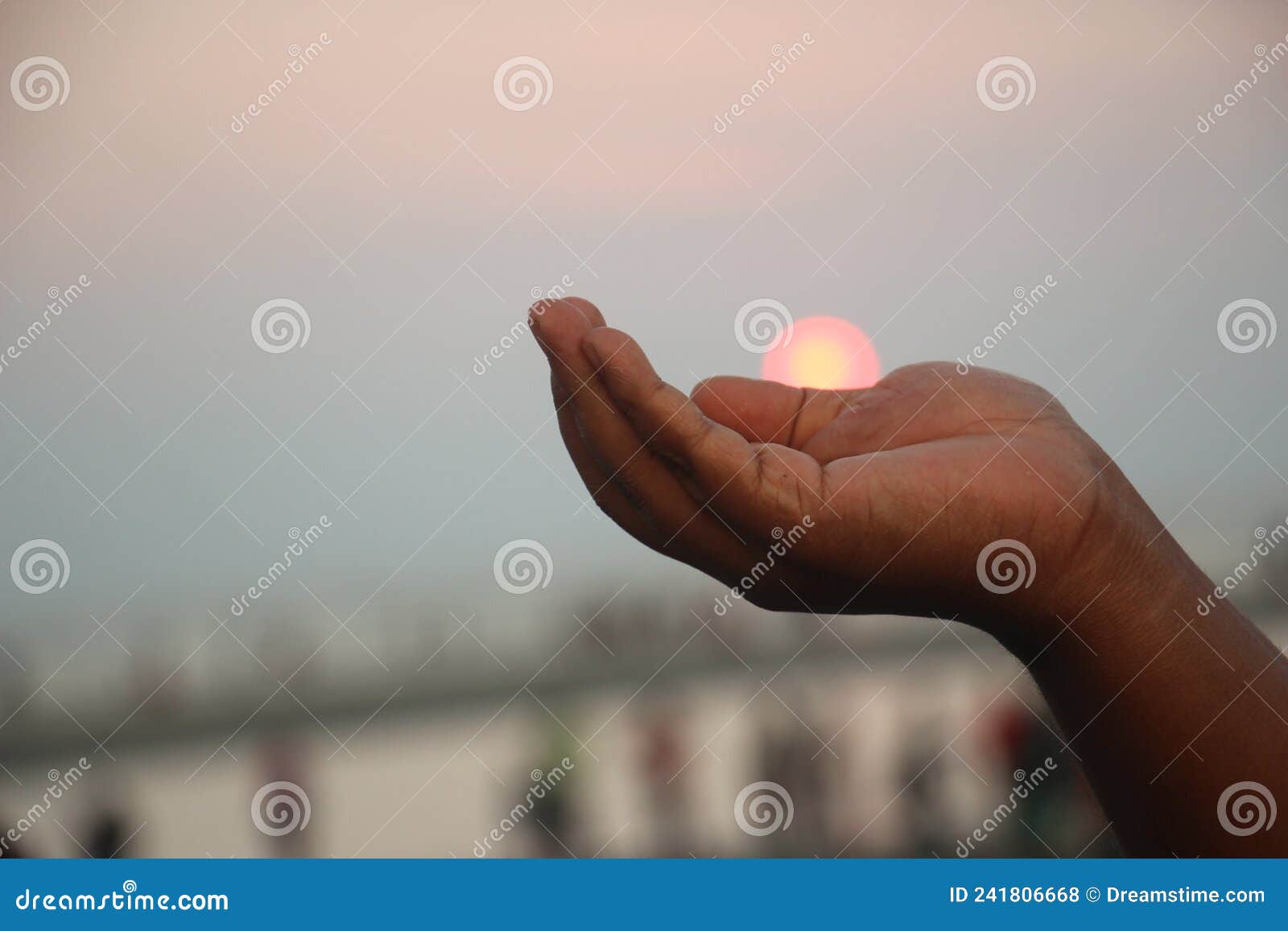 Catch sun in hand. Sunset stock photo. Image of catch - 241806668
