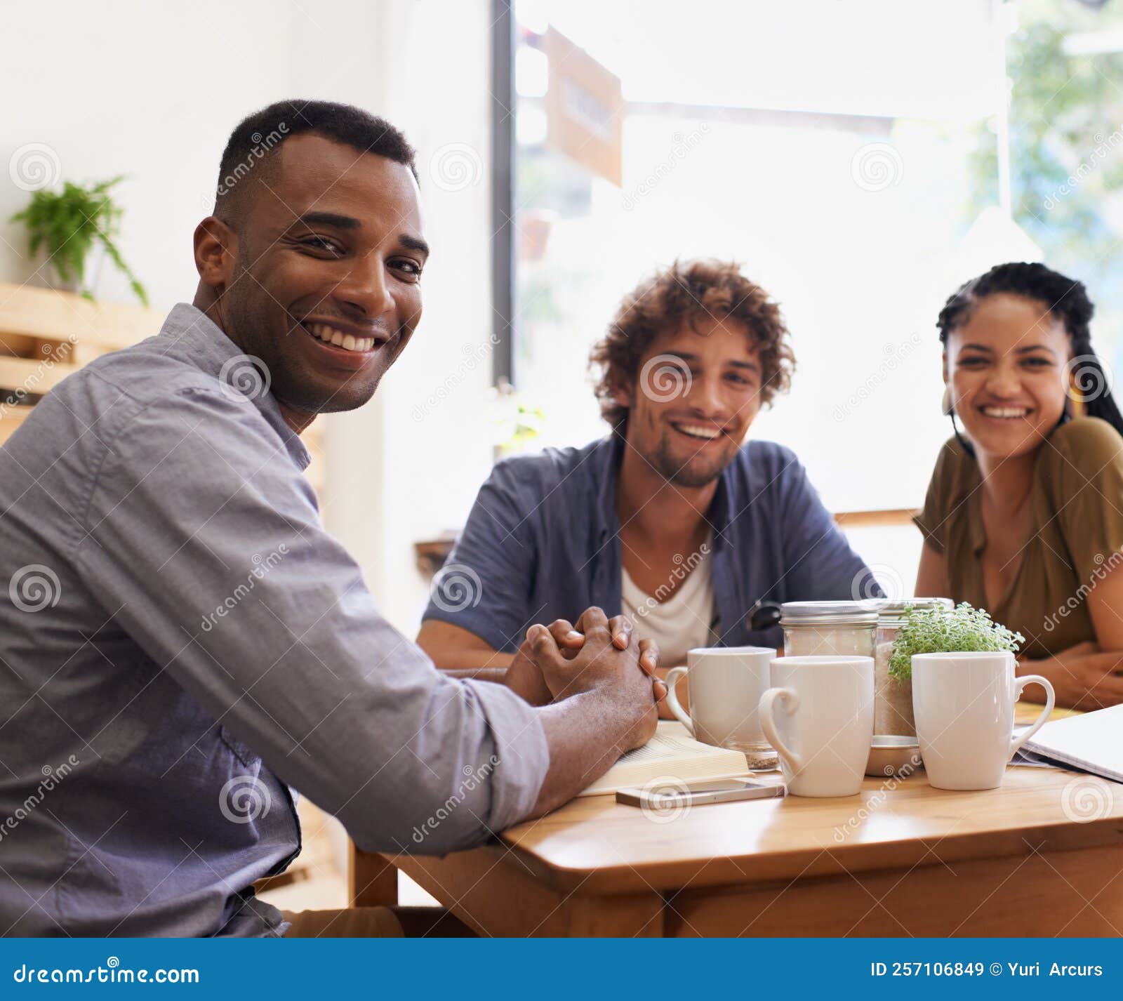 Catching Up with Old Friends. a Group of Friends Talking in a Cafe ...