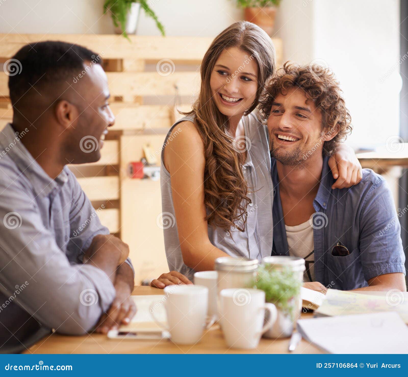 Catching Up with Old Friends. a Group of Friends Talking in a Cafe ...