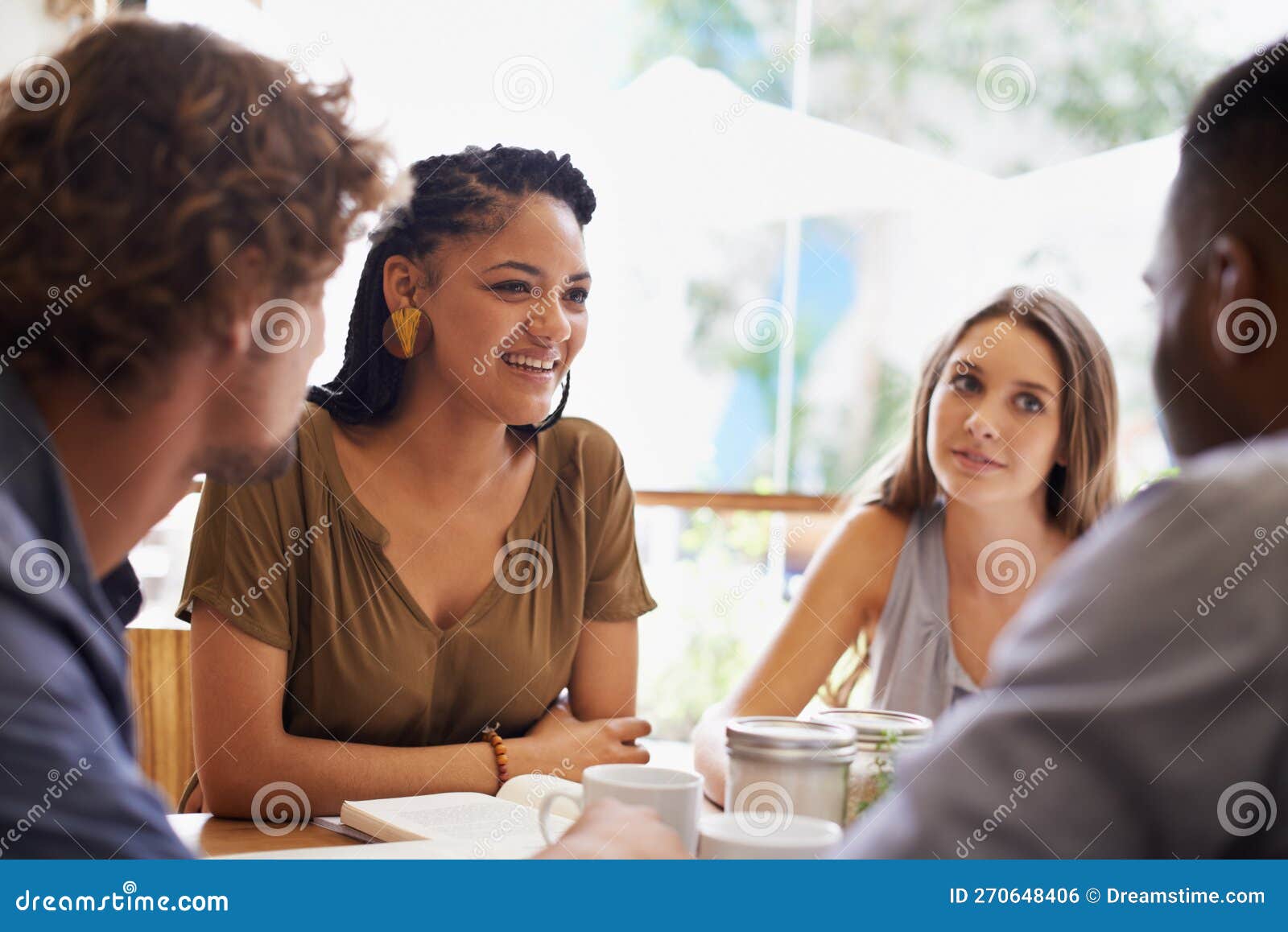 Catching Up with Old Friends. Shot of a Group of Friends Talking in a ...
