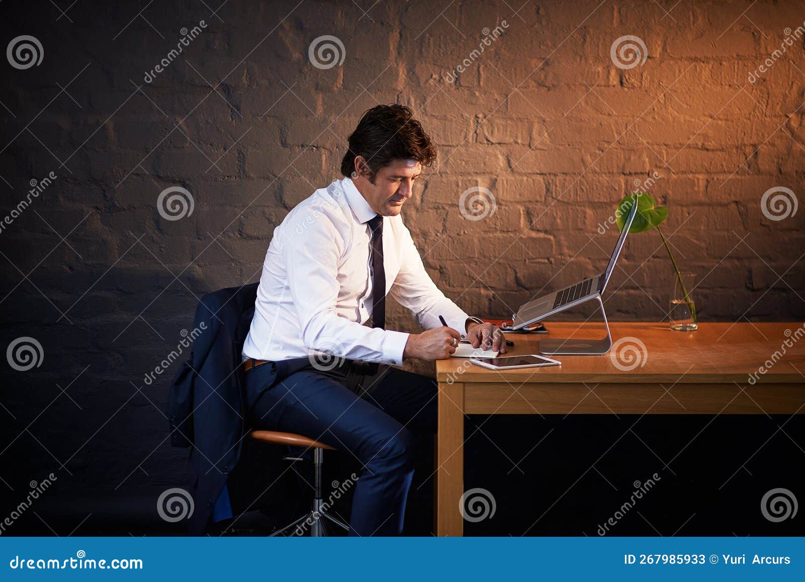 Catching Up on Some Admin. a Businessman Working Late at the Office ...