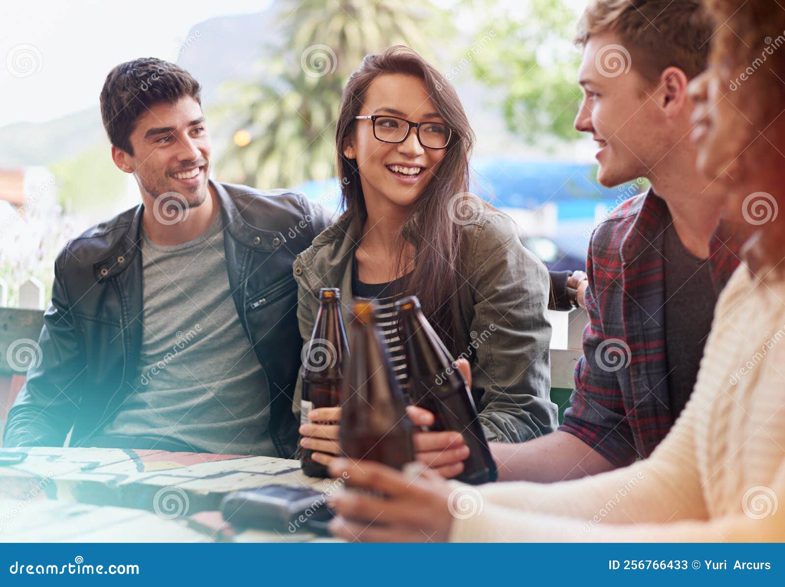 Catching Up with Some Friends. a Group of Friends Drinking Outdoors ...