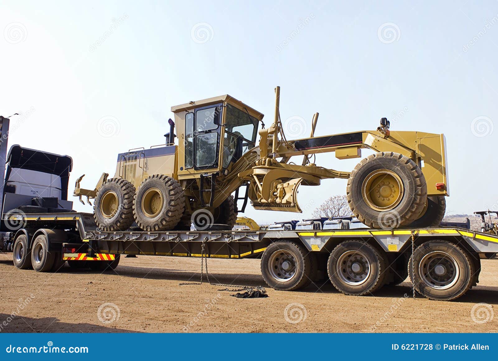 Caterpillar 140H Transporter - on Flatbed Trailer Stock Photo - Image ...