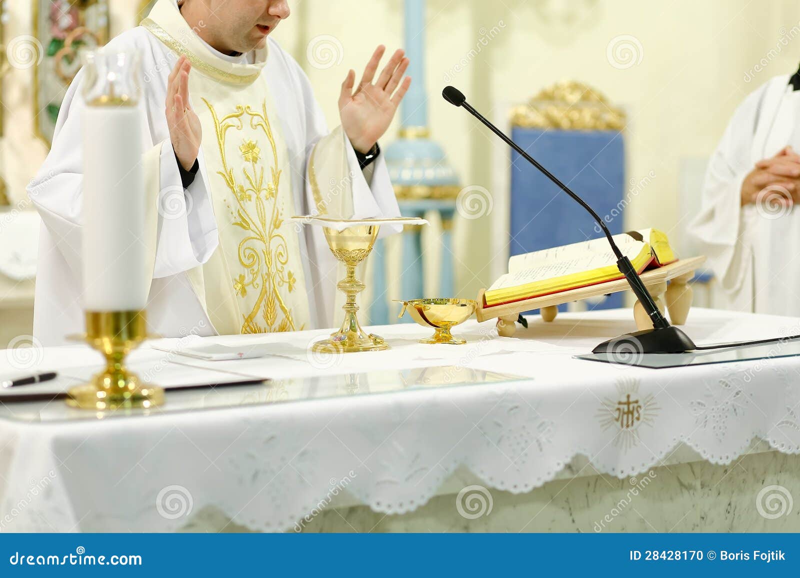 Catholic Priest On Altar Praying During Mass Stock Photography ...