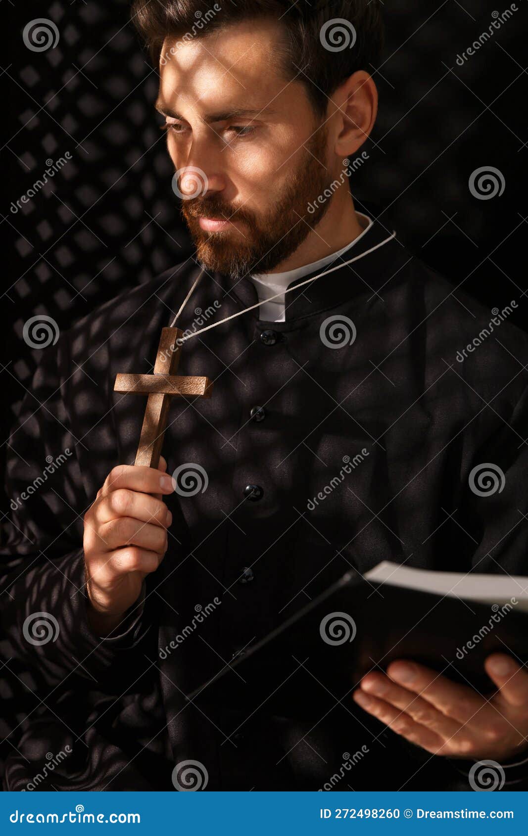 Catholic Priest in Cassock Holding Cross with Bible in Confessional ...