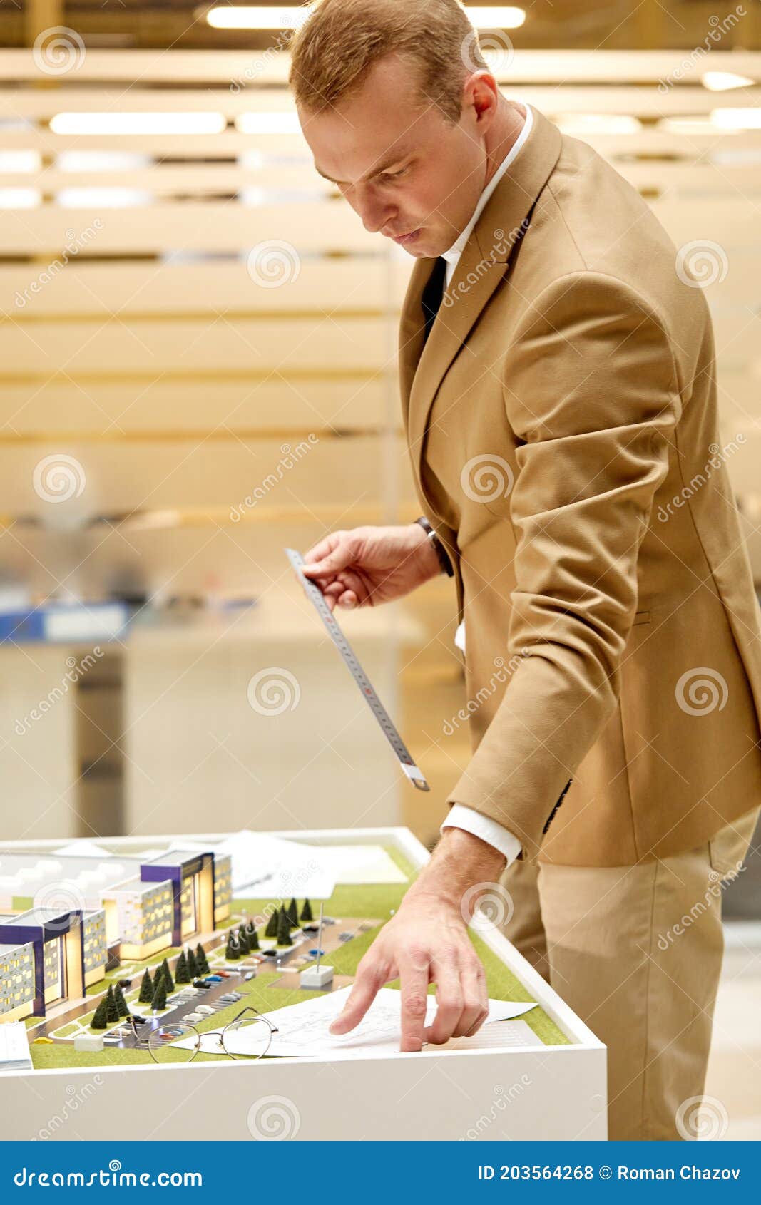 Architect Engineer Man is Concentrated on Designing Building and Ther ...