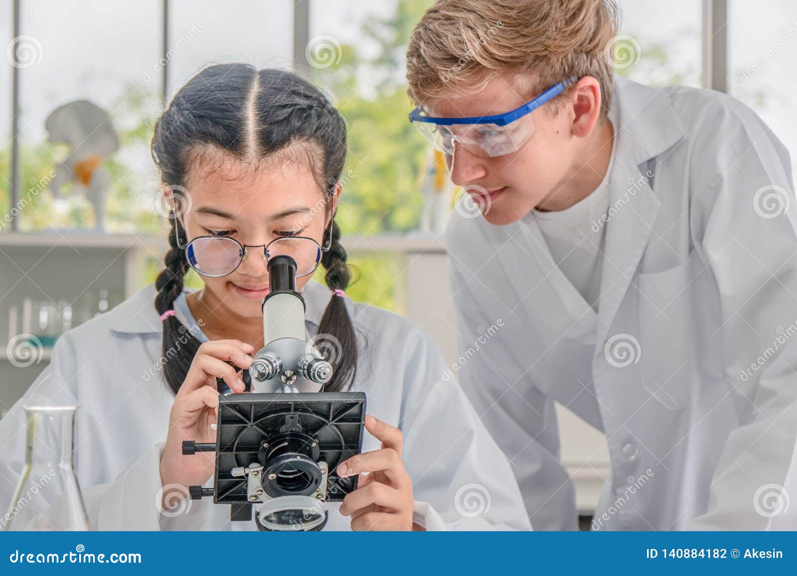Students Using Microscope in Science Laboratory Class Stock Photo ...